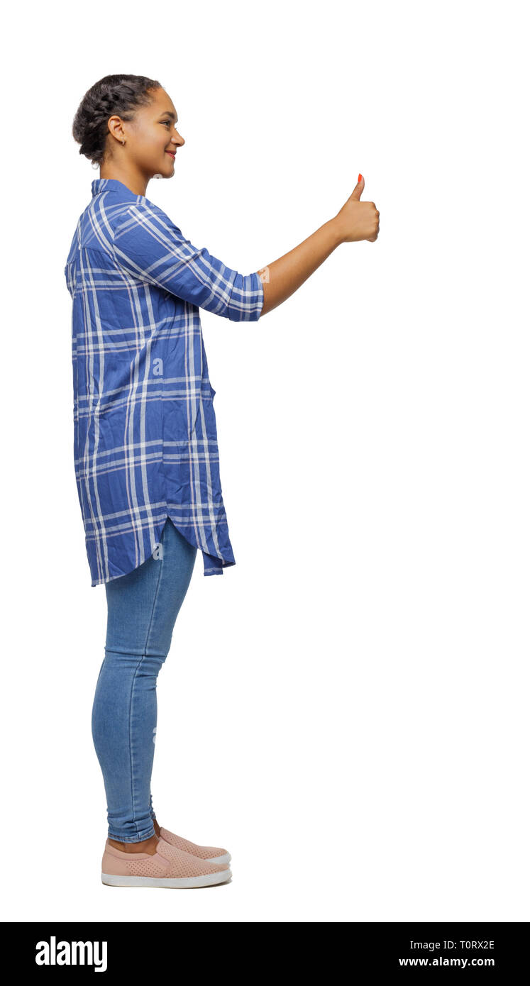 Side view of a black woman showing thumb up. Rear view people ...