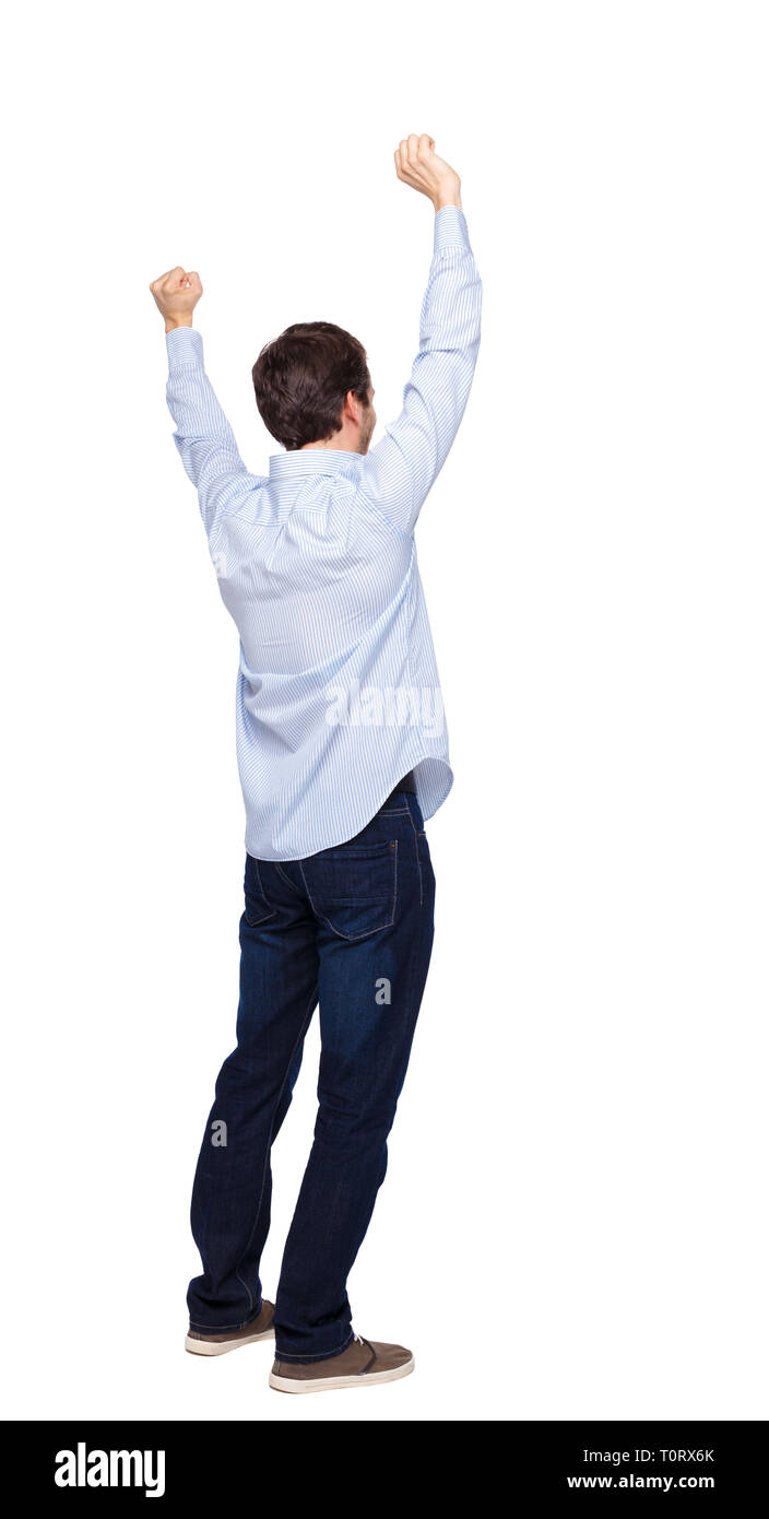 Back view of a man celebrating victory. The fan joyfully raised his ...