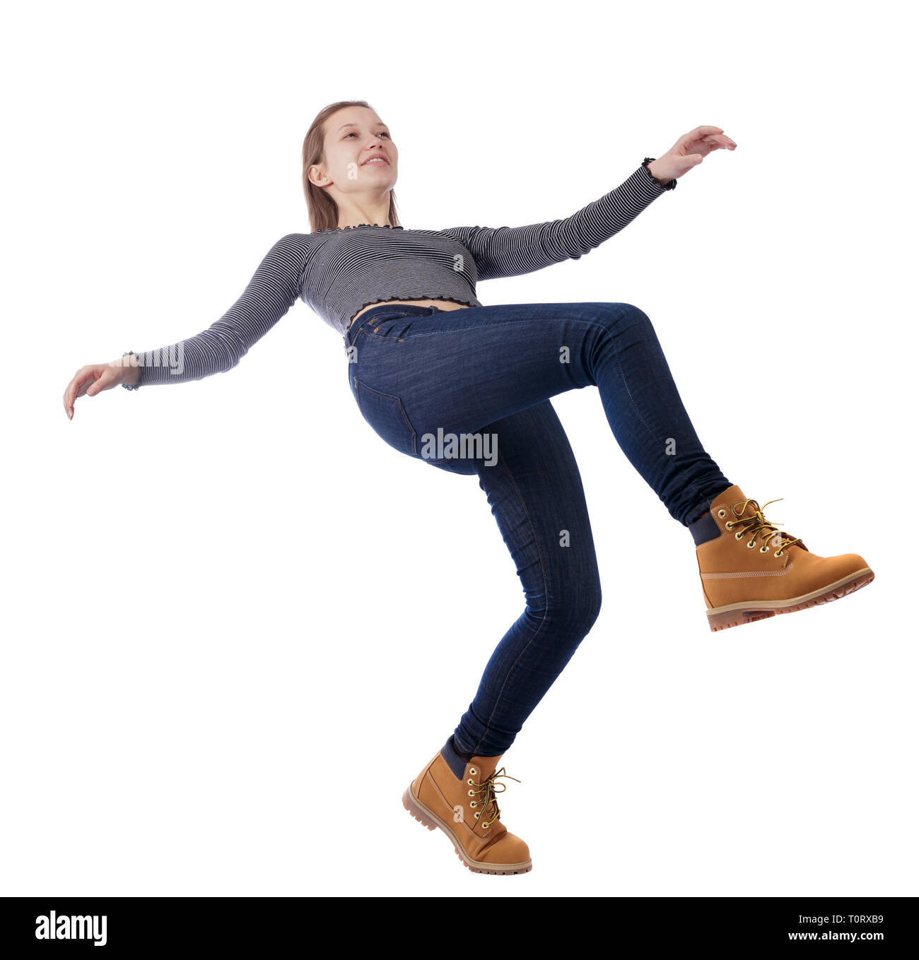 Balancing young woman. or dodge falling woman. Rear view people ...