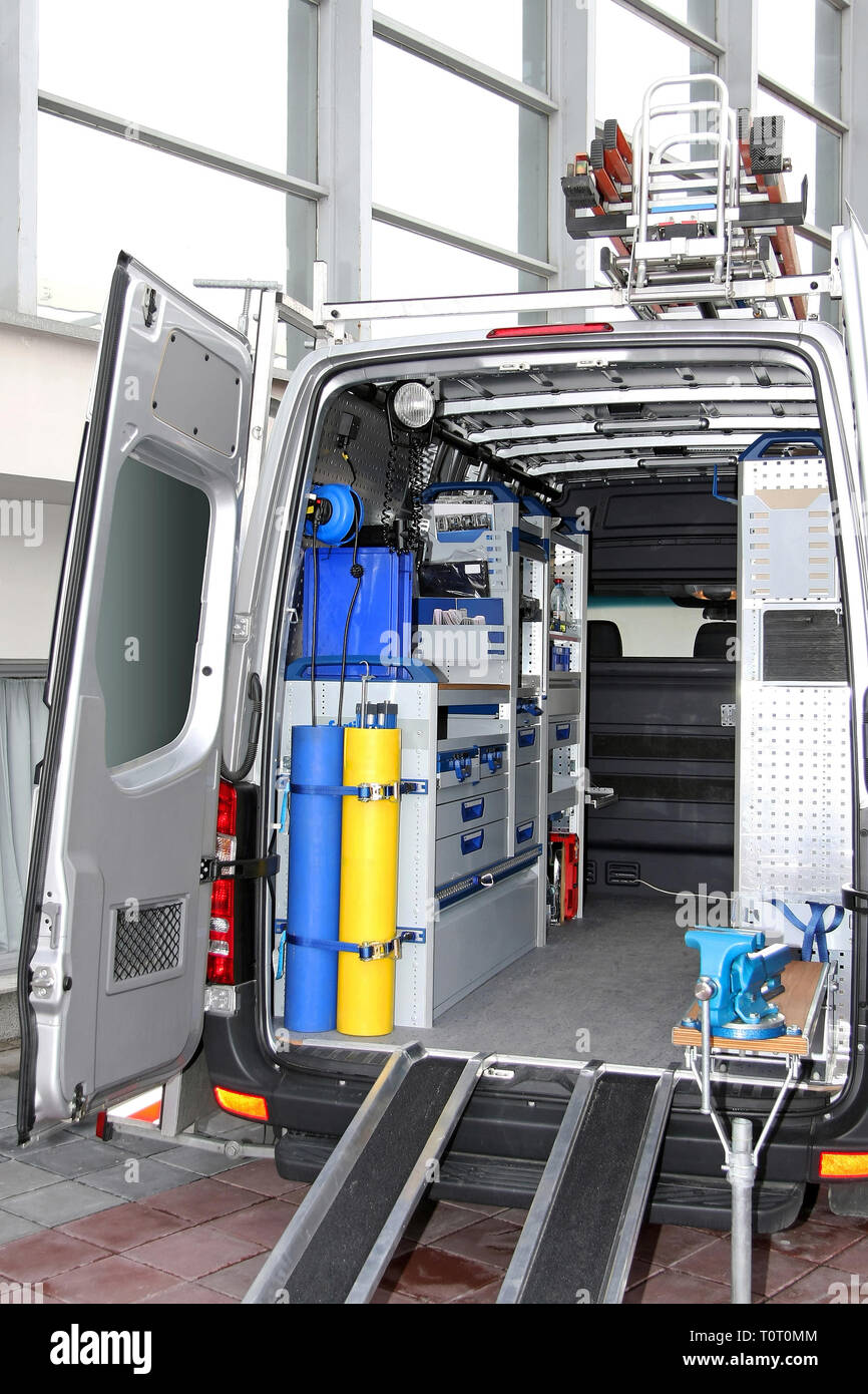 Rear view of utility service van vehicle Stock Photo - Alamy