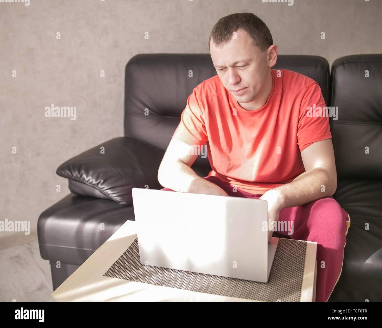 Laptop on couch with white background hi-res stock photography and ...