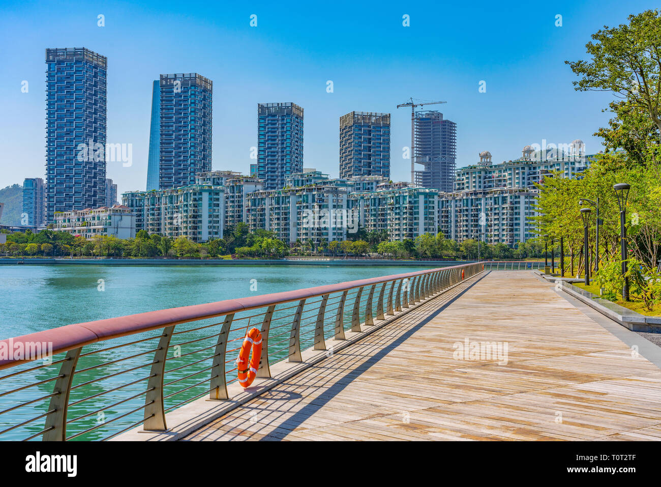 SHENZHEN, CHINA - OCTOBER 30: View of a seaside walking path near high ...