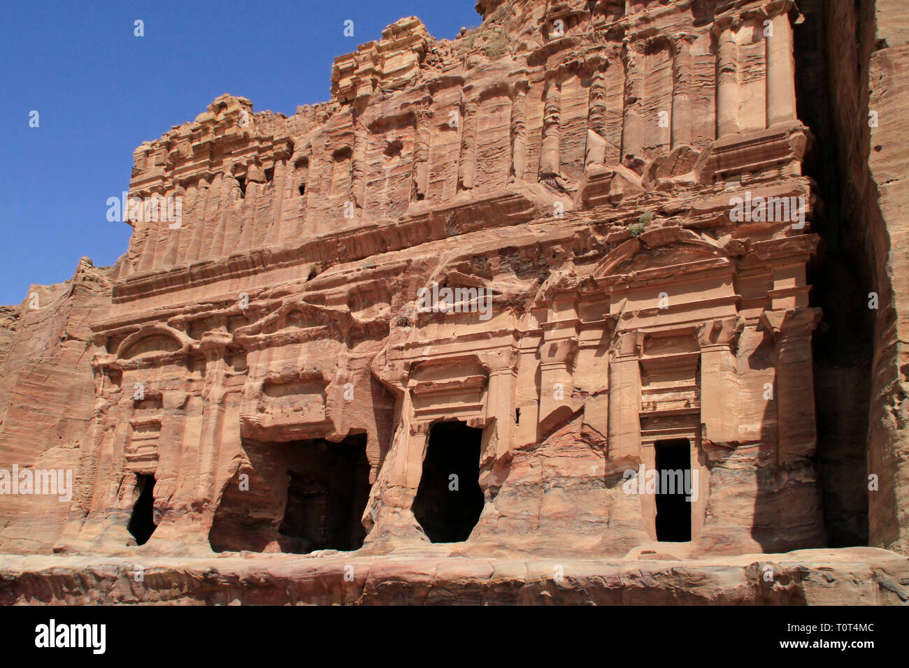 Monumental building carved out of rock in the ancient Jordanian city of ...