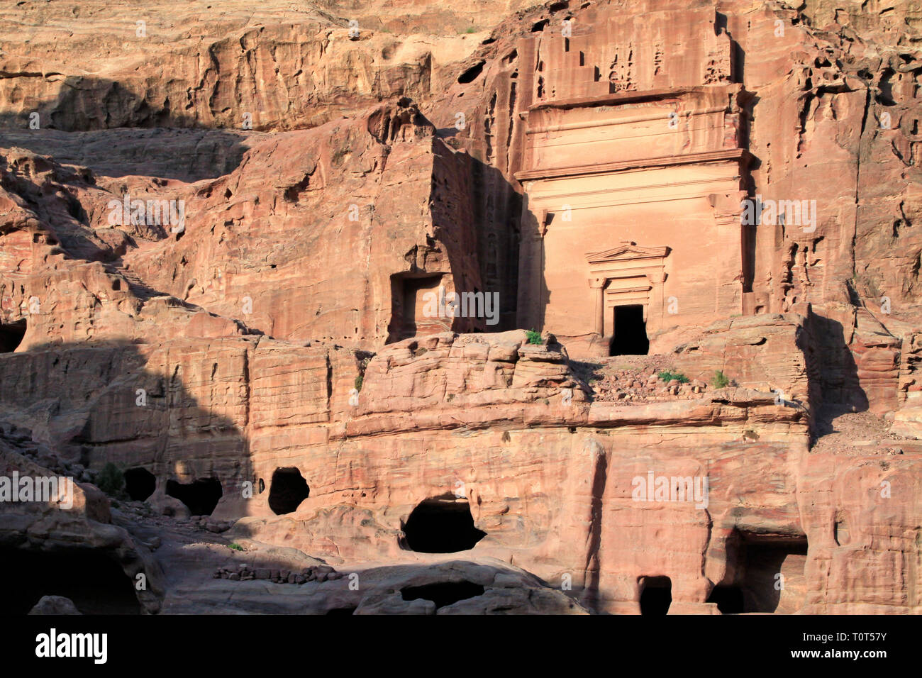 Monumental building carved out of rock in the ancient Jordanian city of ...