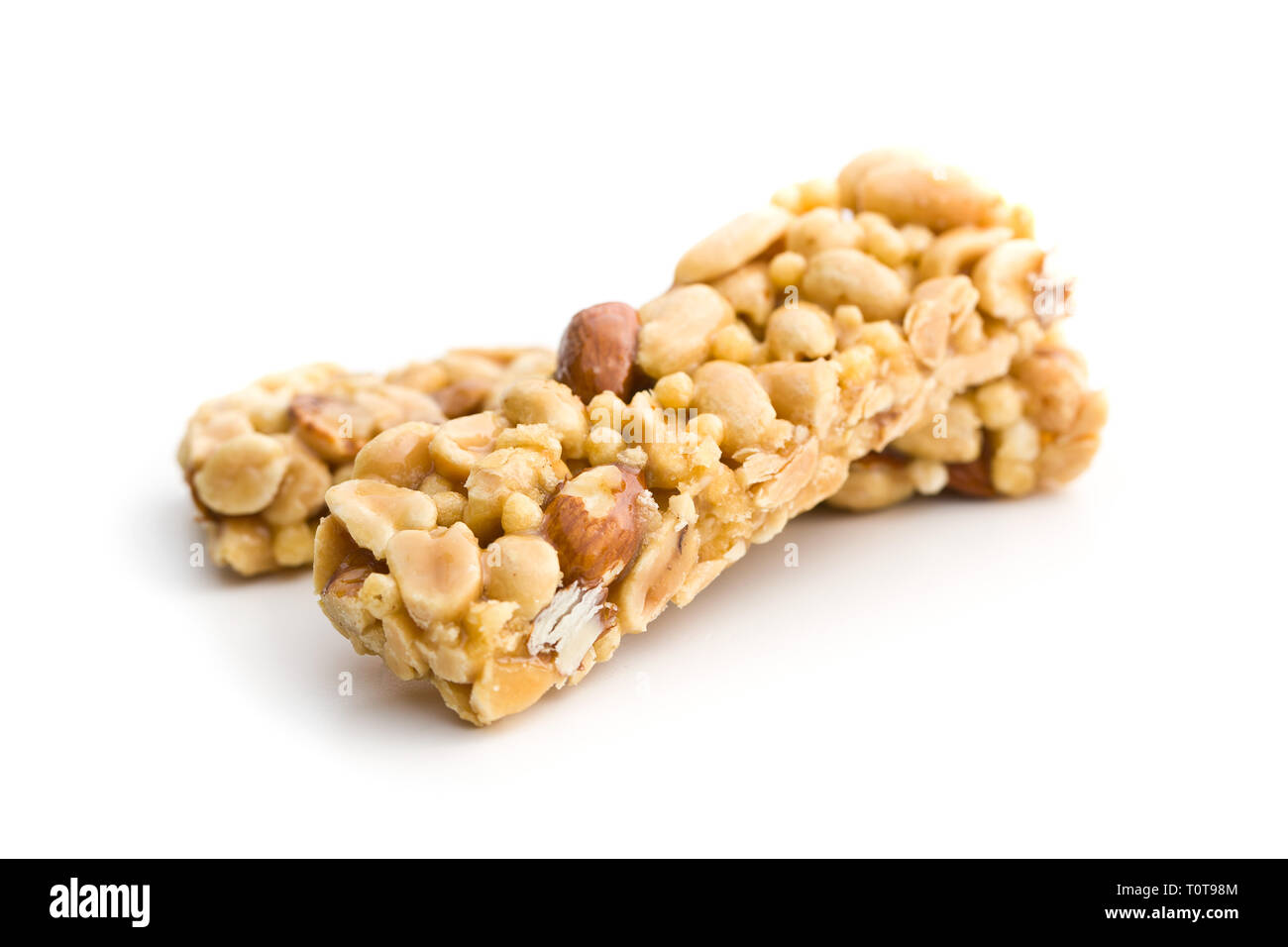 Sweet nut bars with honey isolated on white background Stock Photo - Alamy