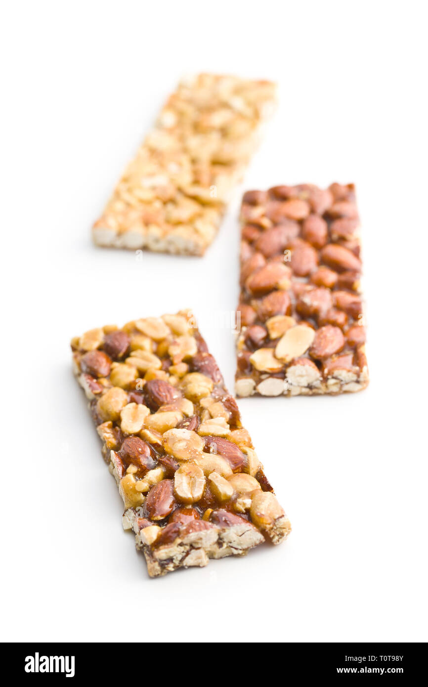 Sweet nut bars with honey isolated on white background Stock Photo - Alamy