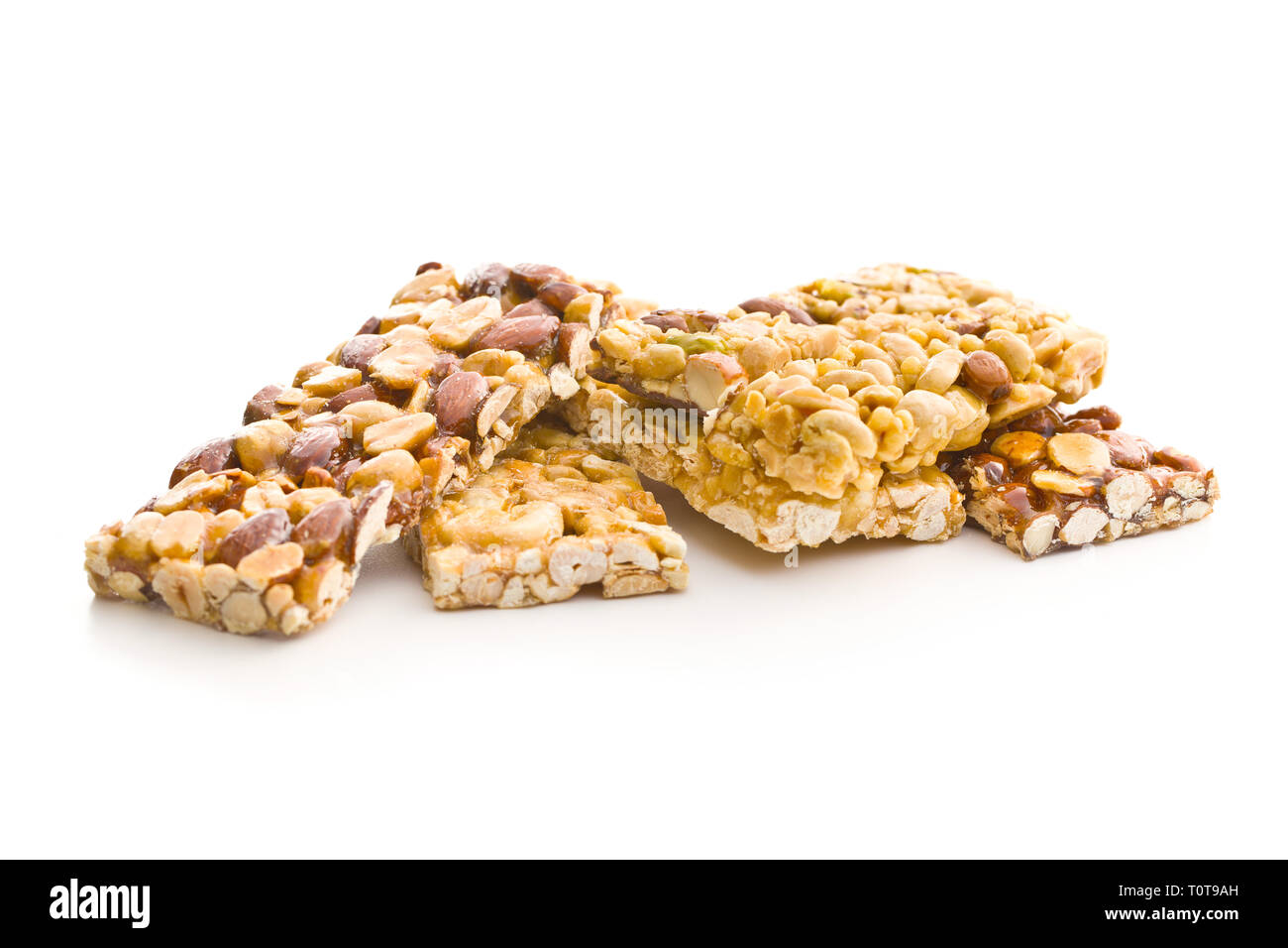 Sweet nut bars with honey isolated on white background Stock Photo - Alamy