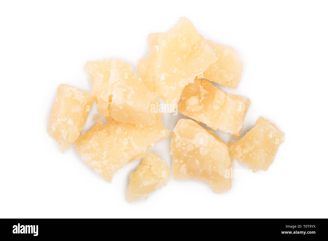 Parmesan cheese pieces isolated on white background. Closeup. Top view ...