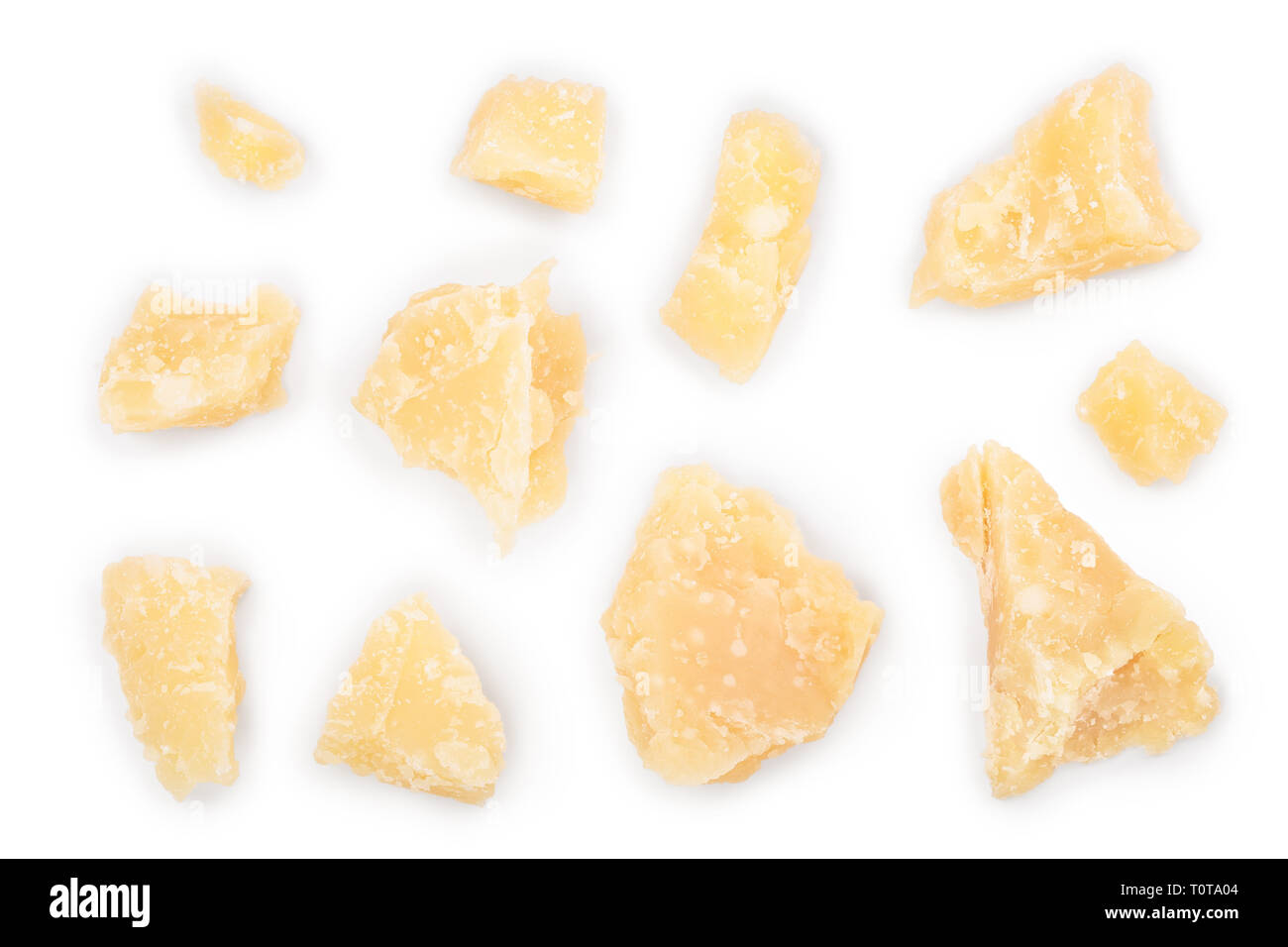 Parmesan cheese pieces isolated on white background. Closeup. Top view ...