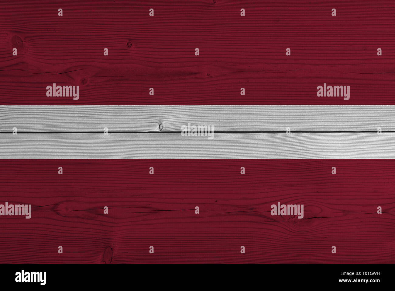 latvia flag painted on old wood plank. Patriotic background. National ...