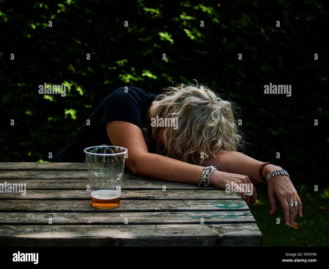 Leaning on a table hi-res stock photography and images - Alamy