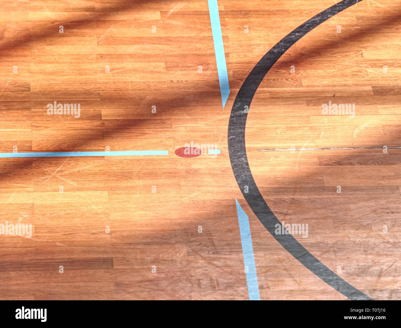 Playfield lines painted on renewal gymnasium wooden floor. Inside ...