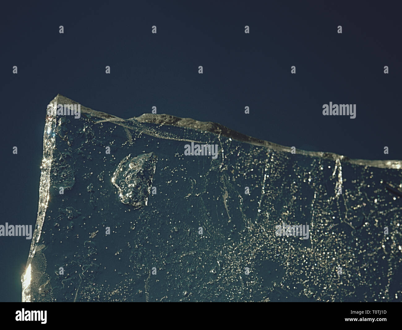 Ice board with cracks and bubbles. Natural flat ice piece Stock Photo ...