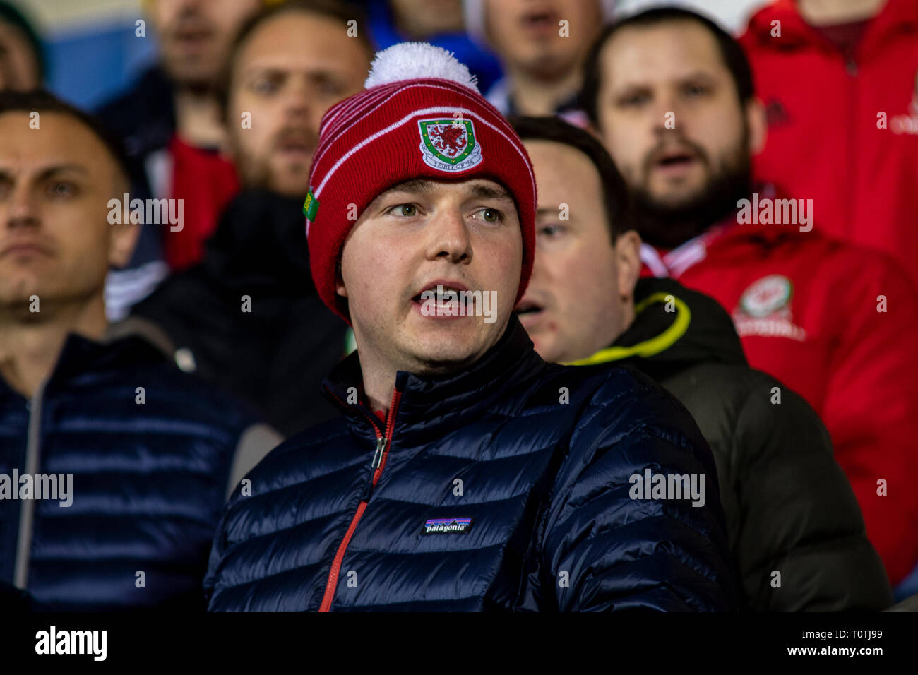 Welsh fans sing the national anthem. Wales v Trinidad & Tobego ...