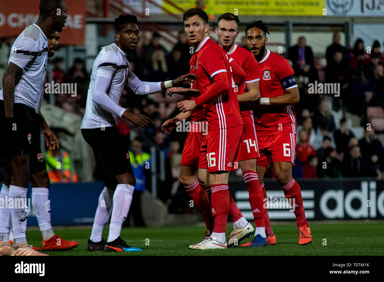 Wales players await a corner in the Trinidad & Tobego box. (L-R) Lee ...