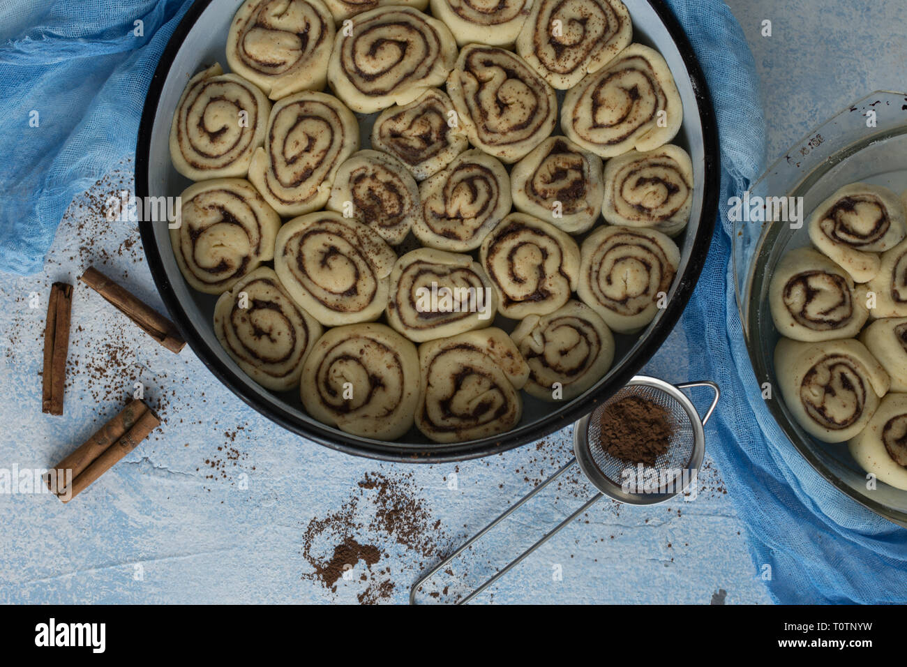 Cinnamon rolls ready to be baked Stock Photo - Alamy
