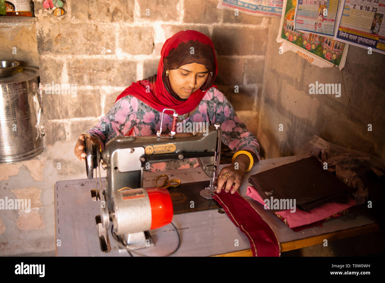 Indian woman sewing machine hi-res stock photography and images - Alamy