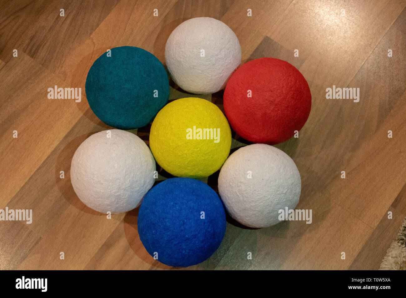 Group of seven colourful spheres on the floor Stock Photo - Alamy
