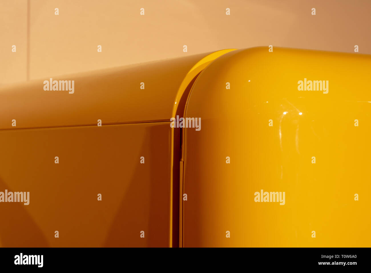 Yellow fridge round corner closeup Stock Photo - Alamy