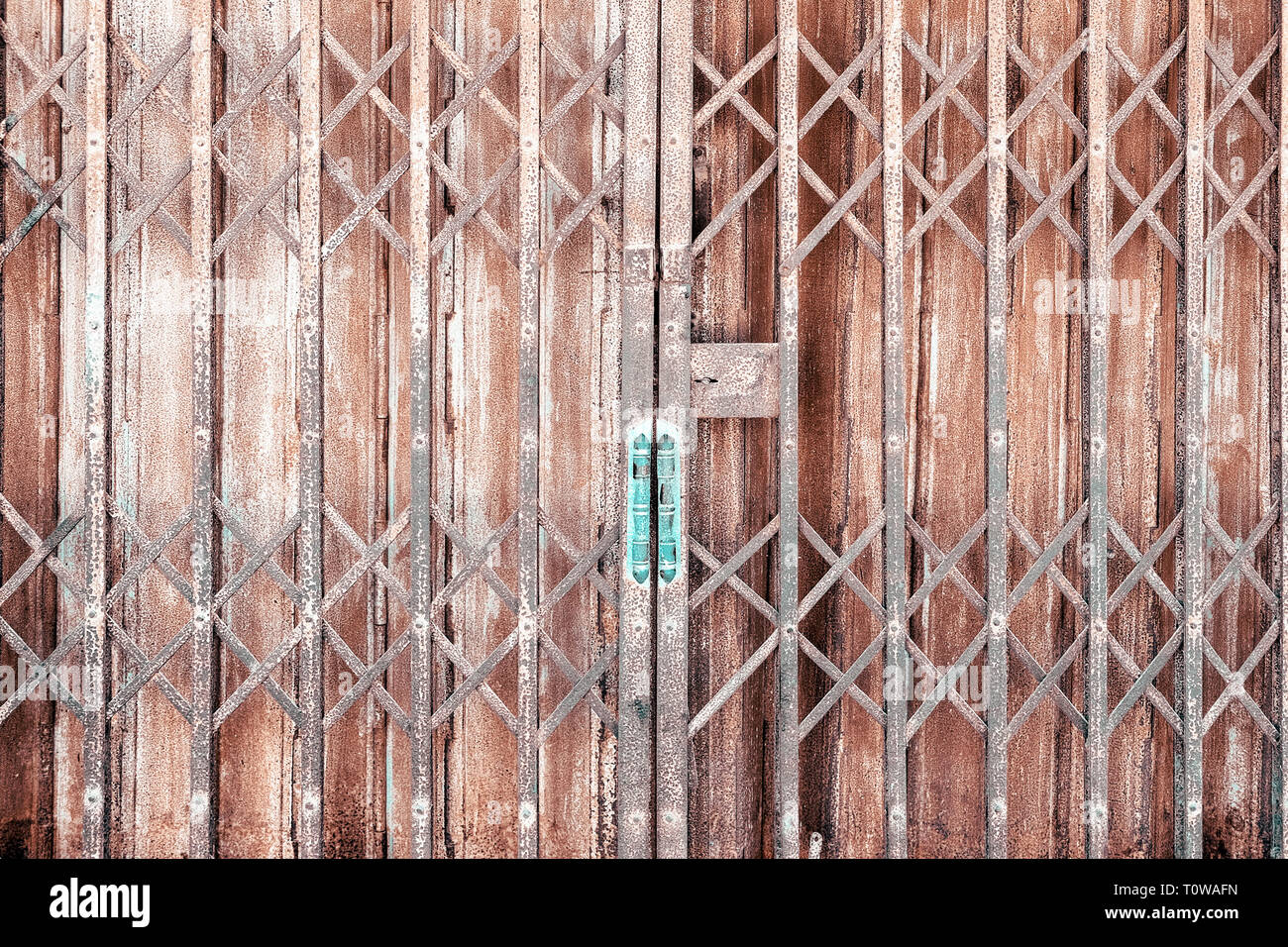 Old vintage style zinc sliding door Stock Photo - Alamy
