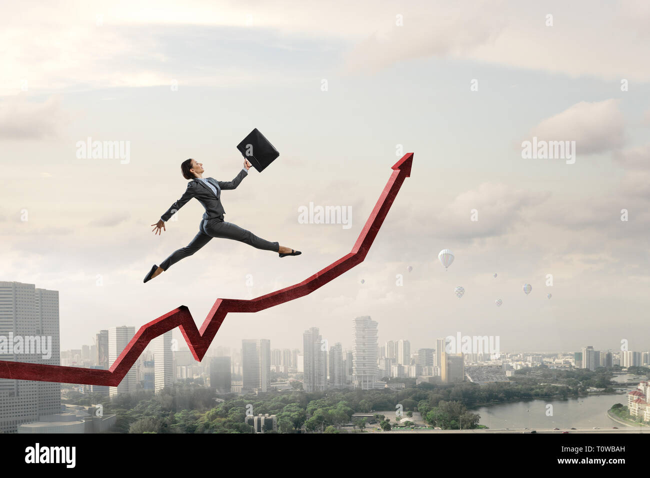 Making big success jump . Mixed media Stock Photo - Alamy