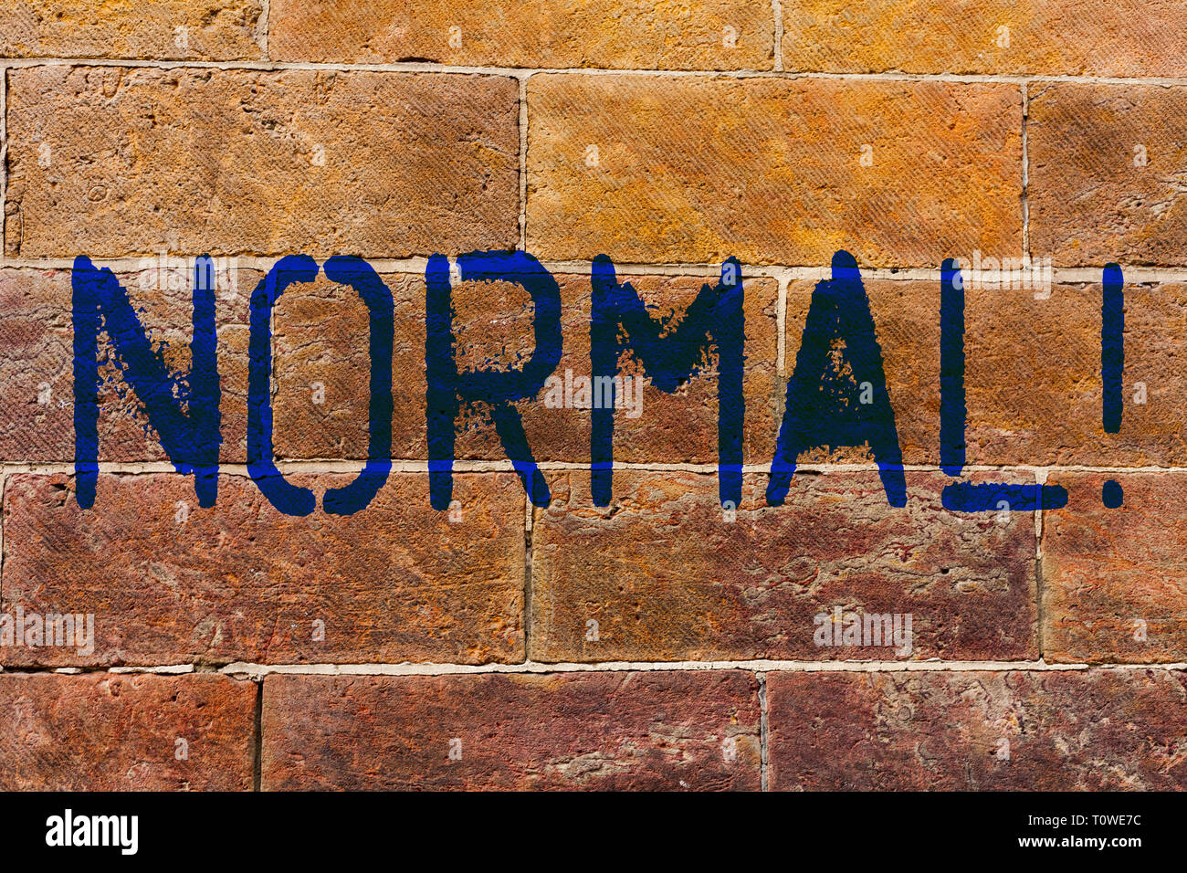 Conceptual hand writing showing Normal. Concept meaning conforming to a ...