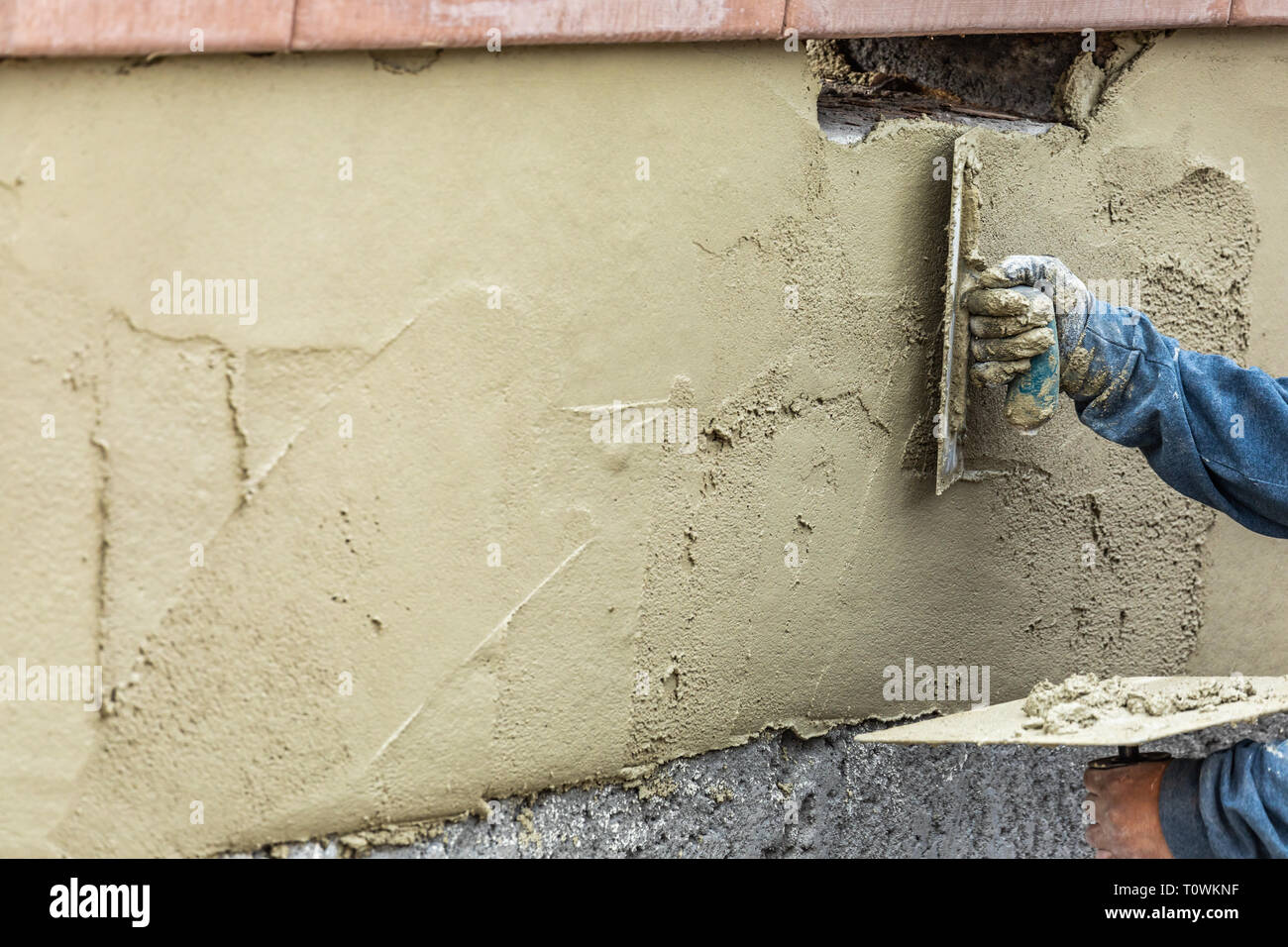 Tile Worker Applying Cement with Trowel at Pool Construction Site Stock ...