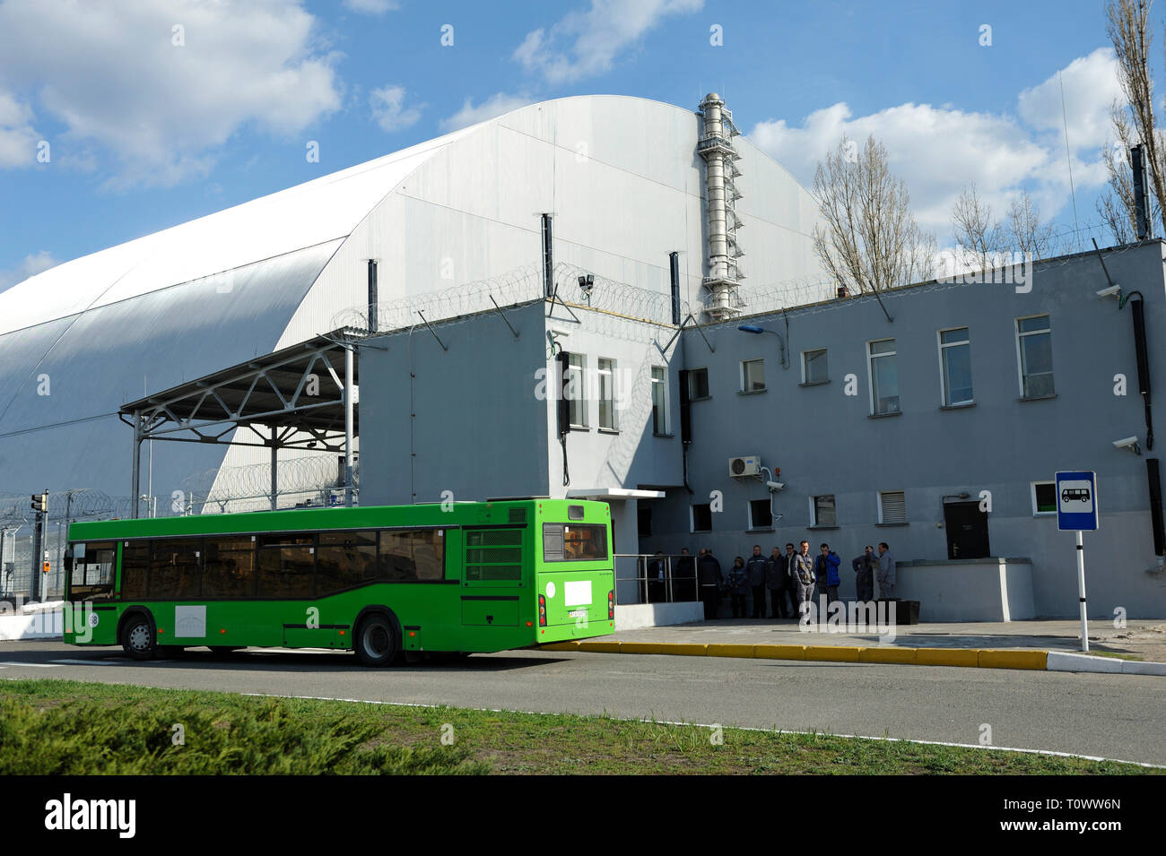 Workers of the Chernobyl Nuclear Power Plant waiting for a bus on a bus ...
