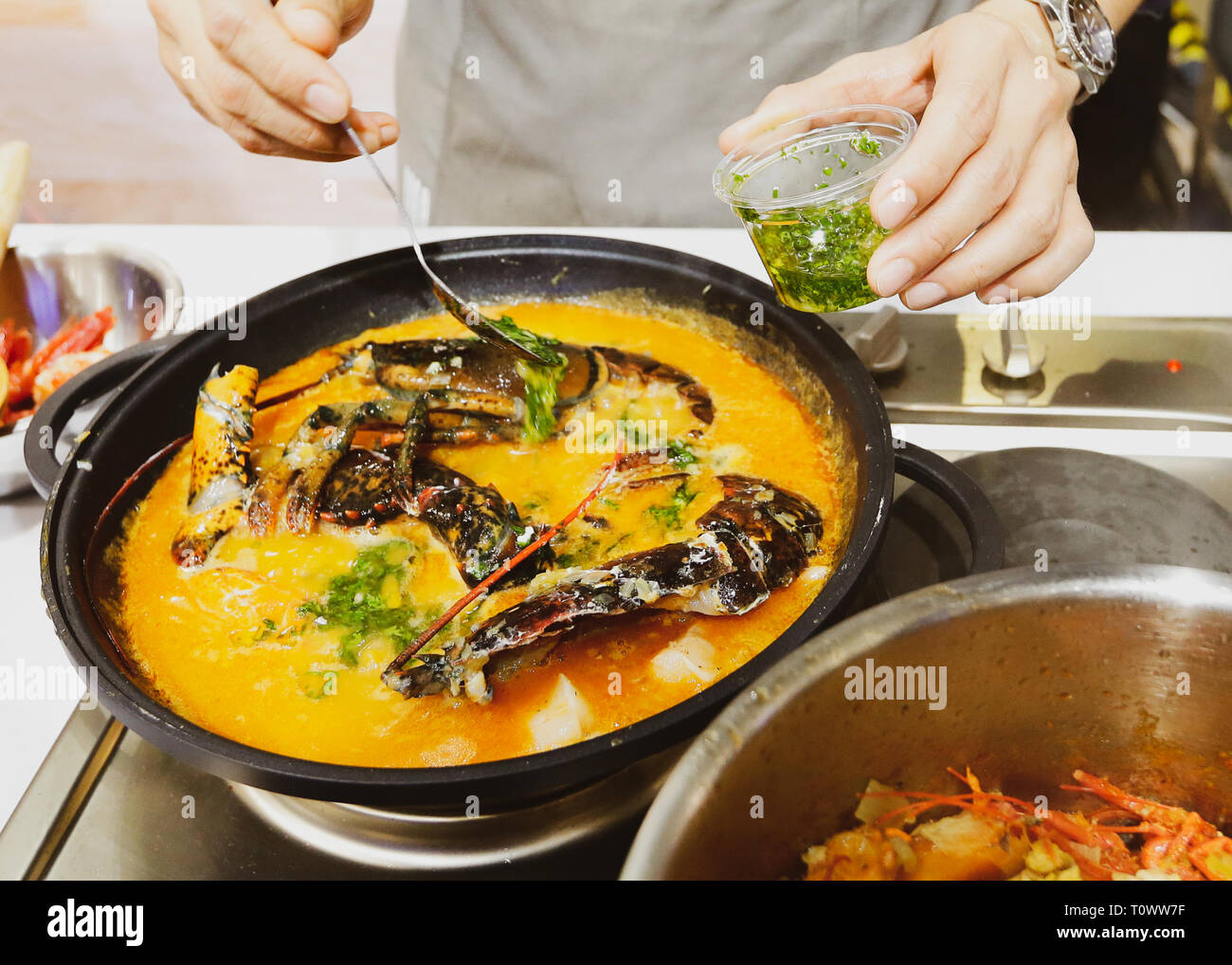 Chef cooking food in the kitchen, Traditional Spanish paella Stock ...