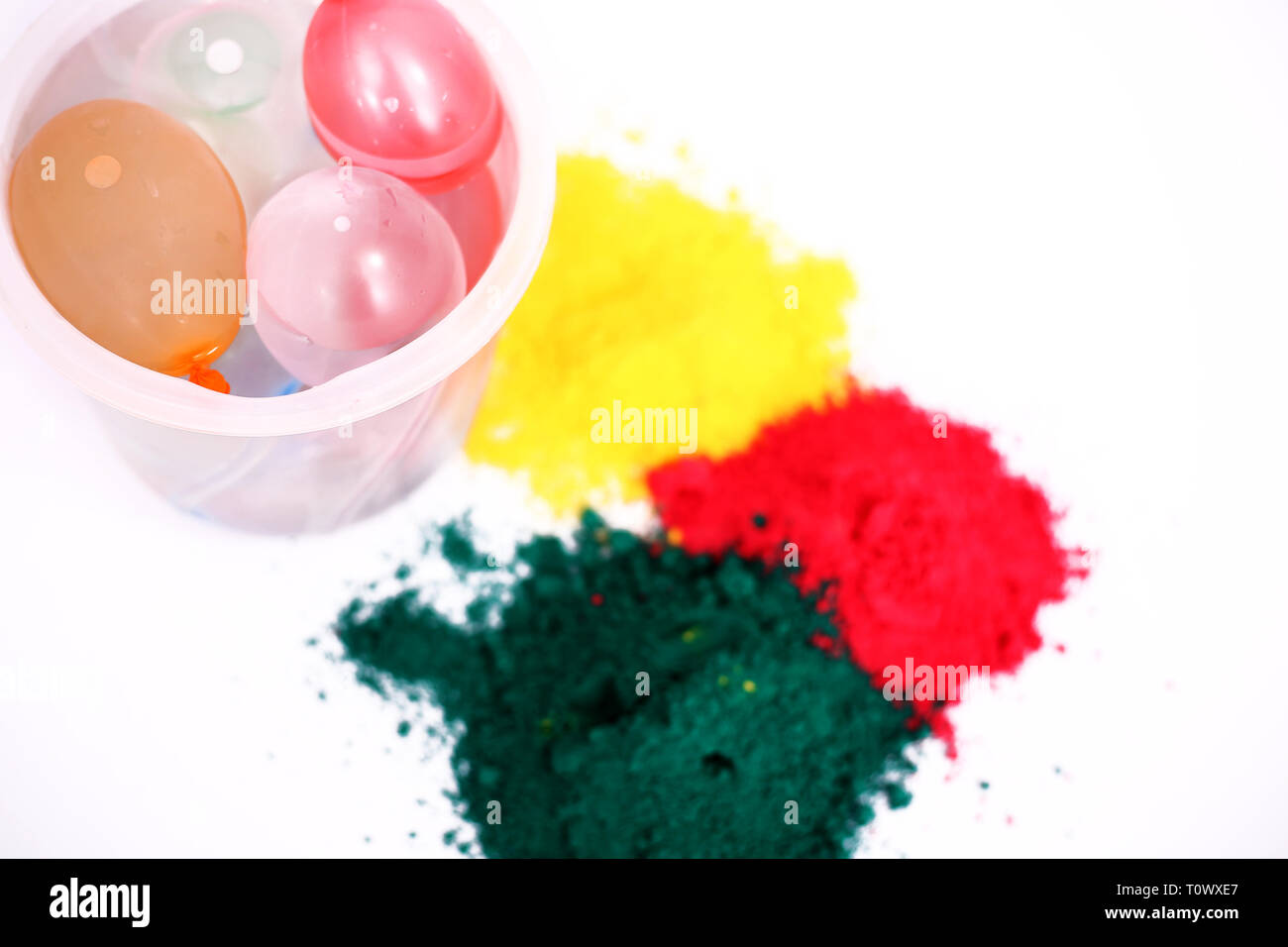 Picture of holi color with water balloons in bucket for holi fun ...