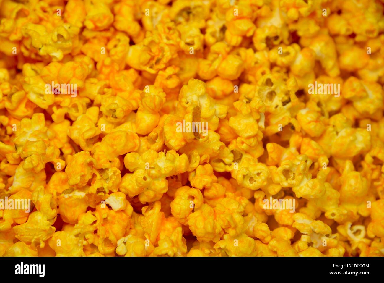 Close up pile of lots of crunchy, crisp delicious cheddar cheddar ...