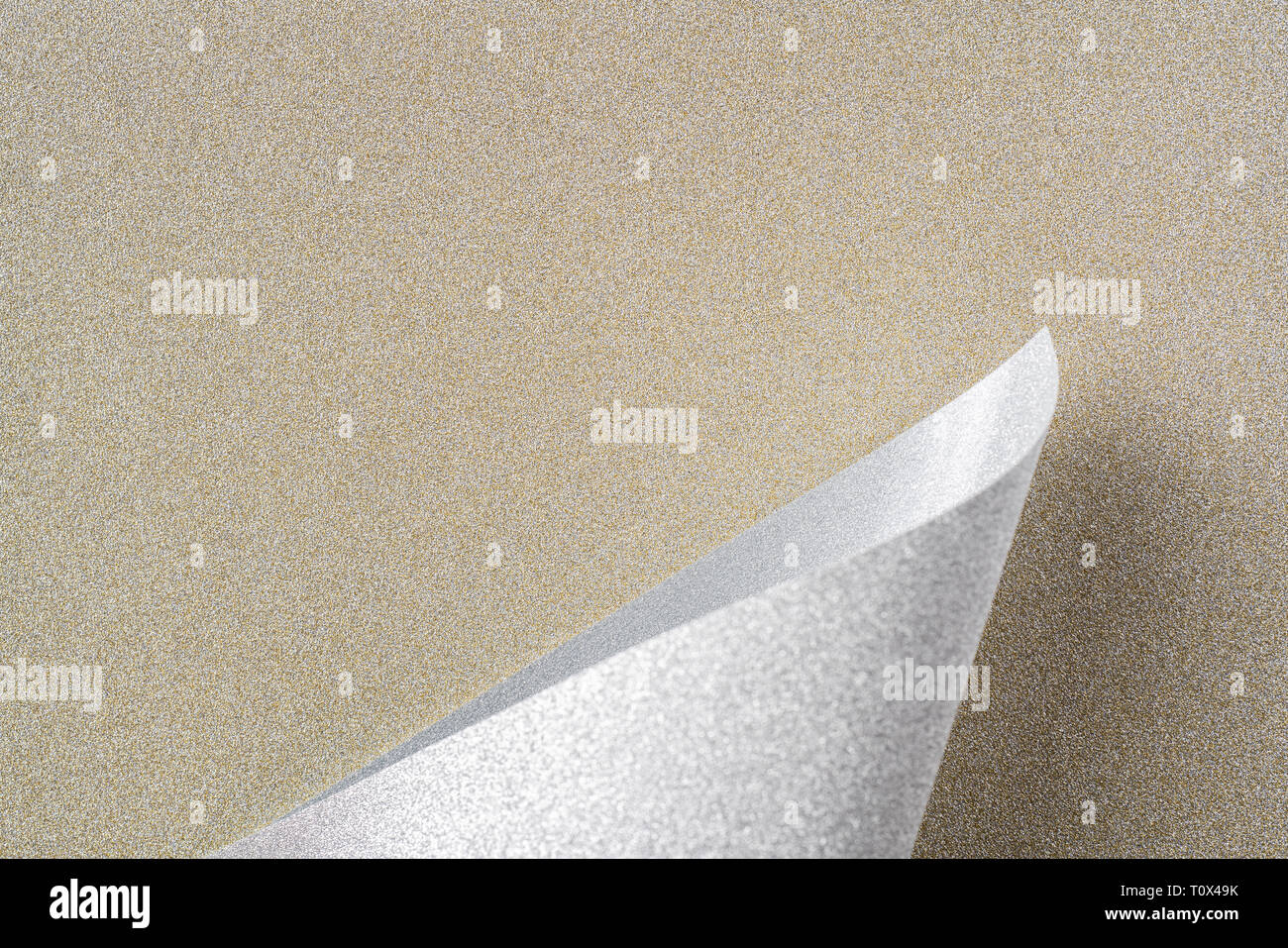 Design concept - silver folded paper on golden background Stock Photo ...