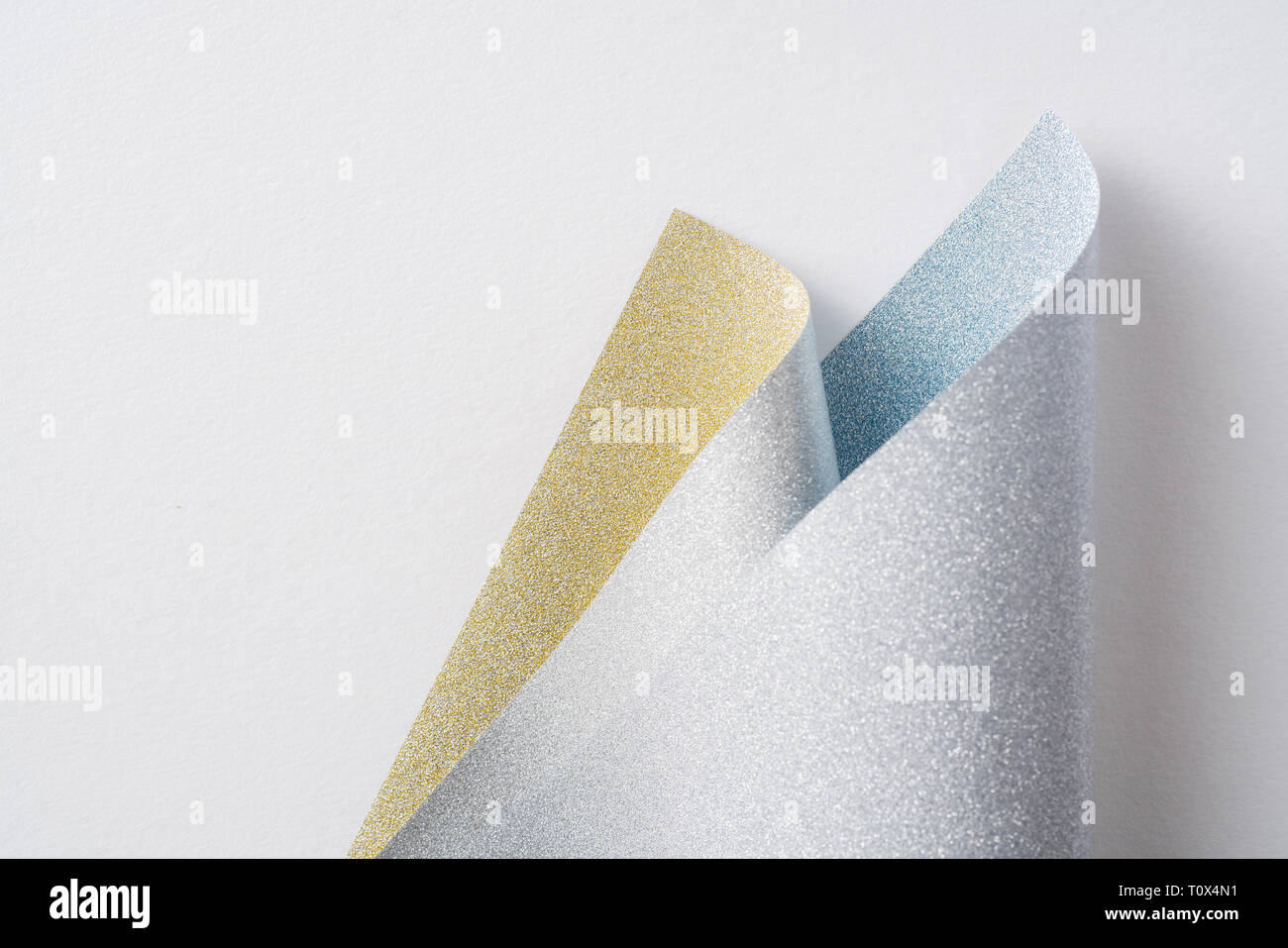 Design concept - silver and golden folded paper on golden background ...