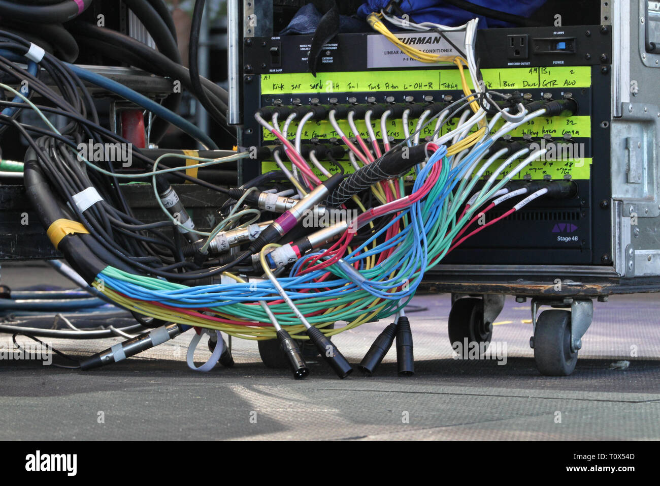 Audio cables and power cords are shown in this close up photo of ...