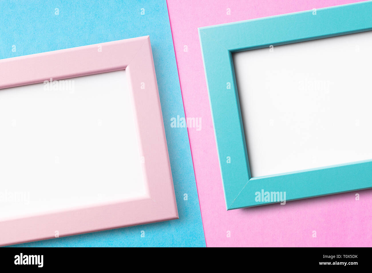 Design concept - green and pink wood frame on blue and pink paper ...