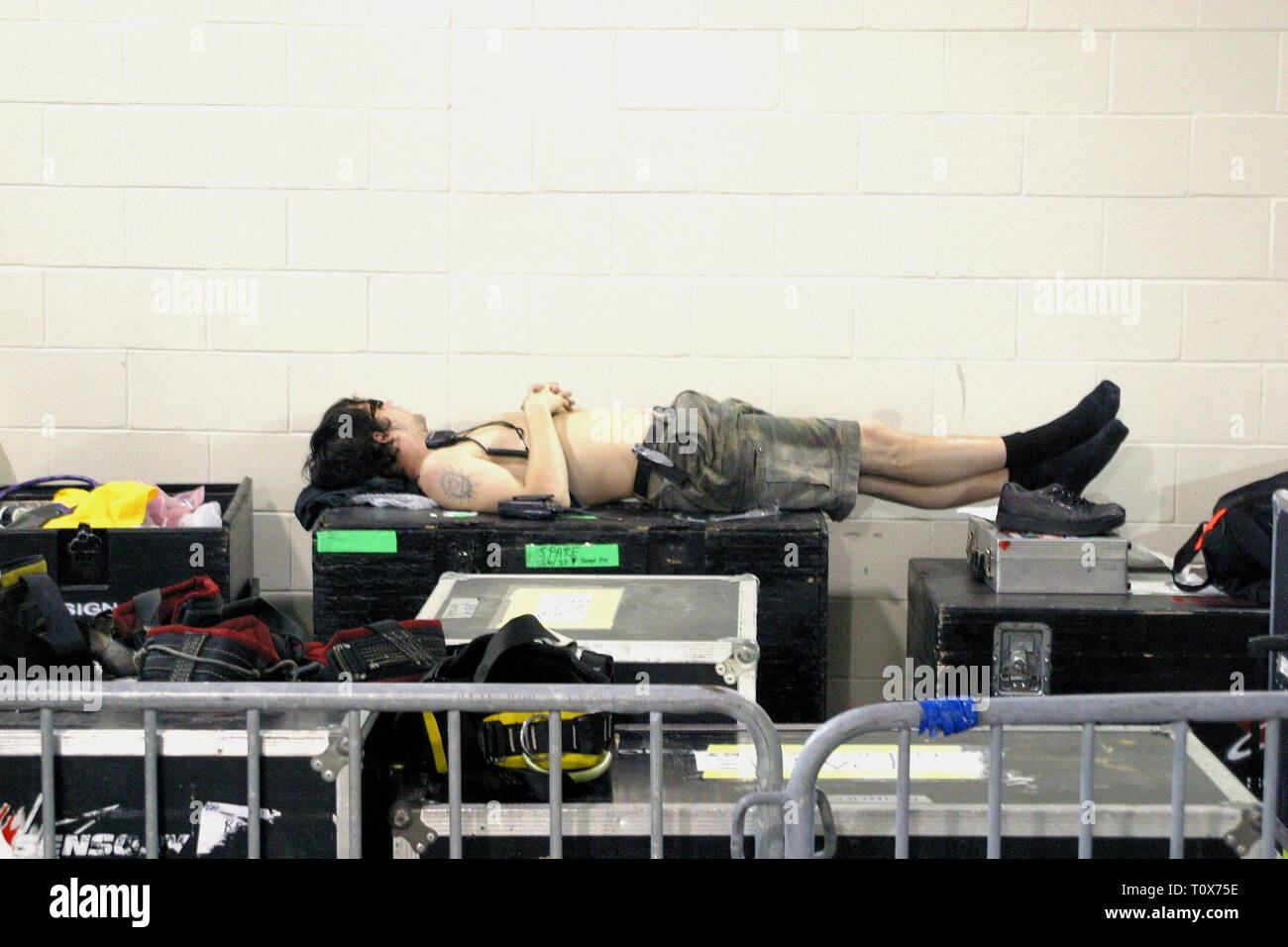 A roadie is shown taking a quick break during the "live" concert event ...
