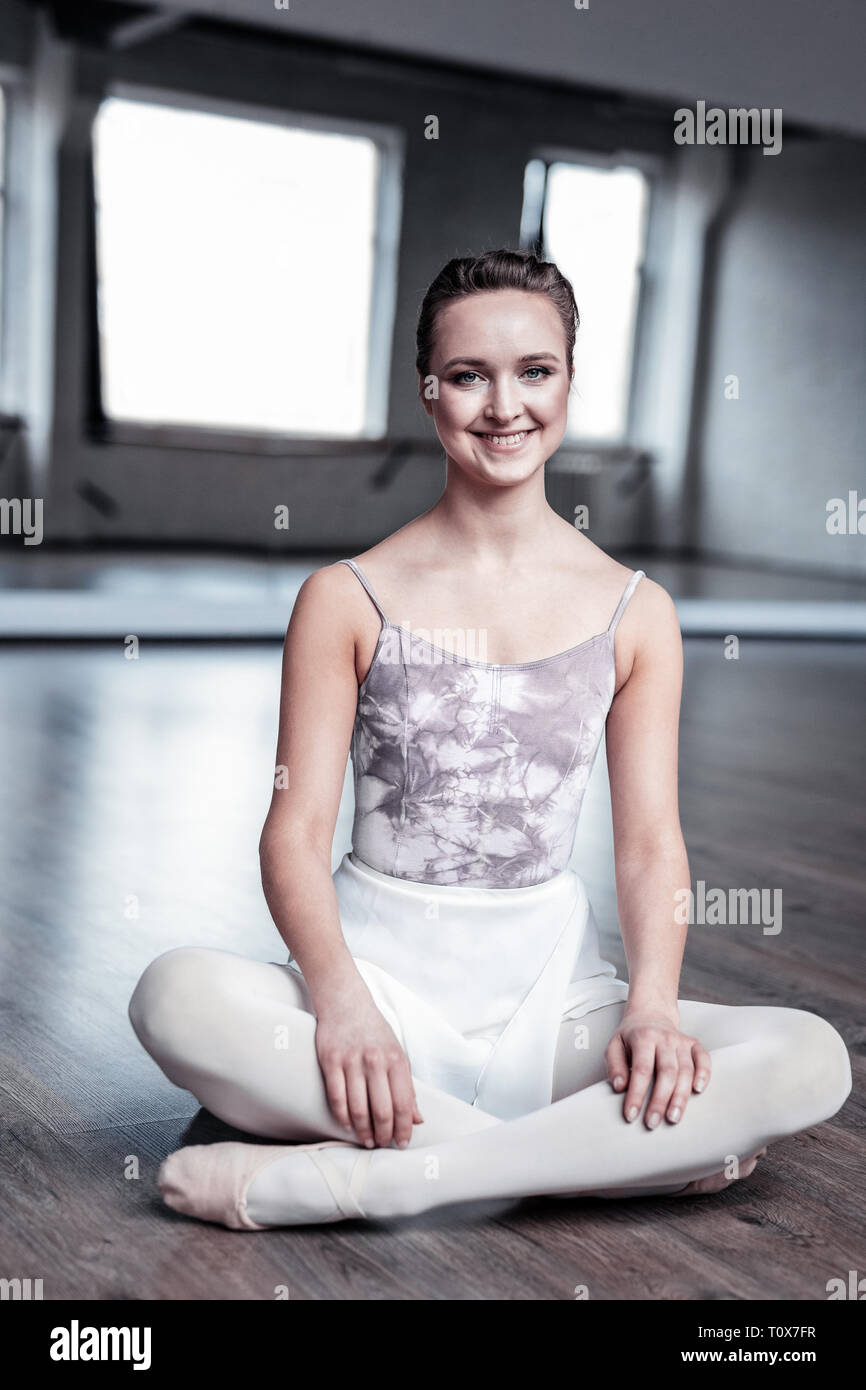 Joyful nice ballet dancer smiling to you Stock Photo - Alamy