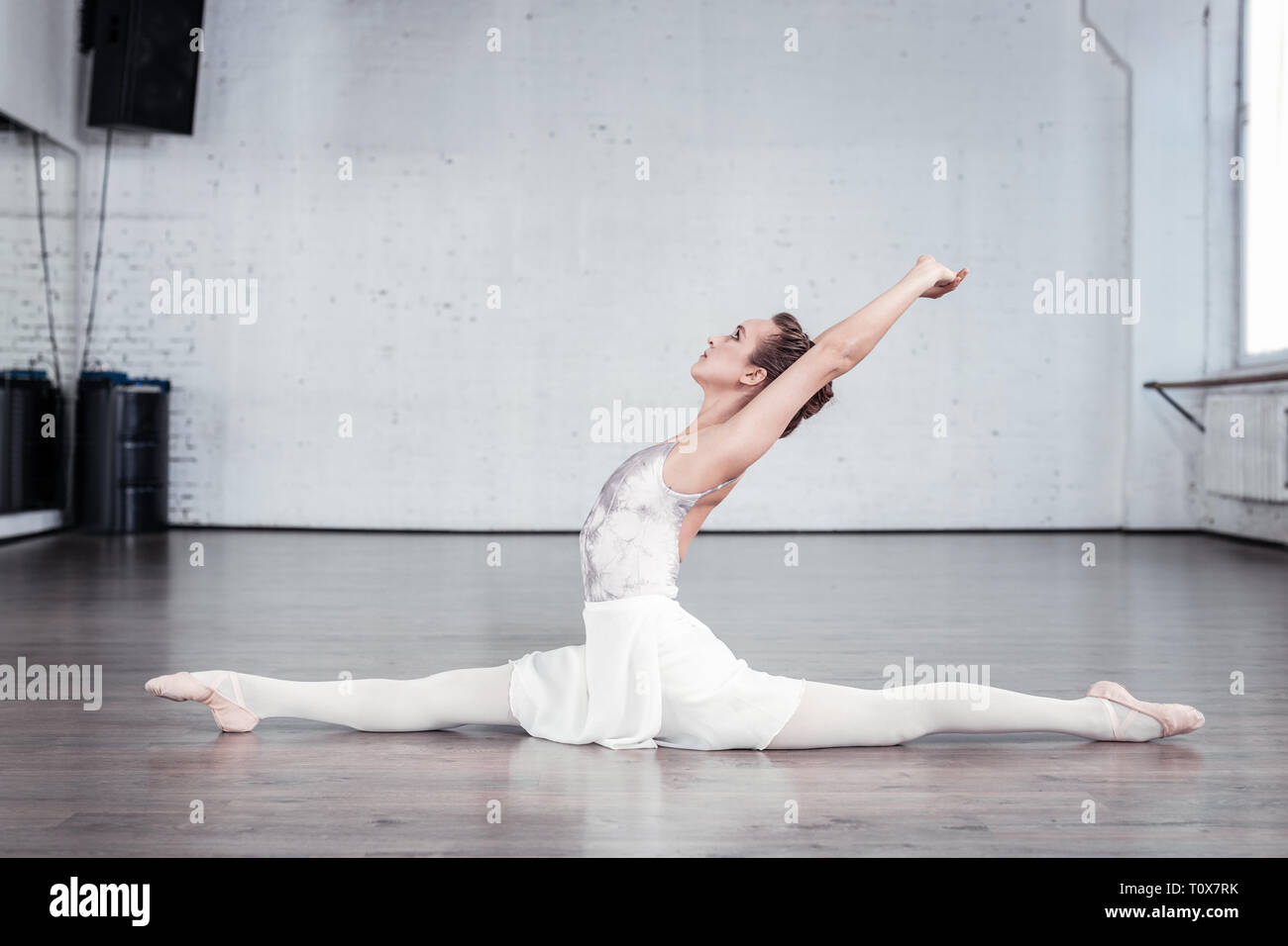 Slim graceful young woman doing the splits Stock Photo - Alamy