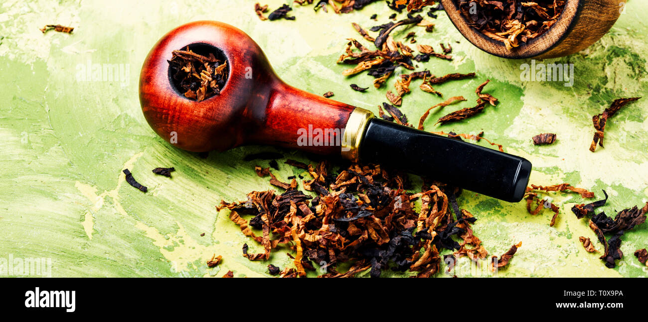 Tobacco pipe or smoking pipe.Classic wooden pipe with tobacco Stock ...