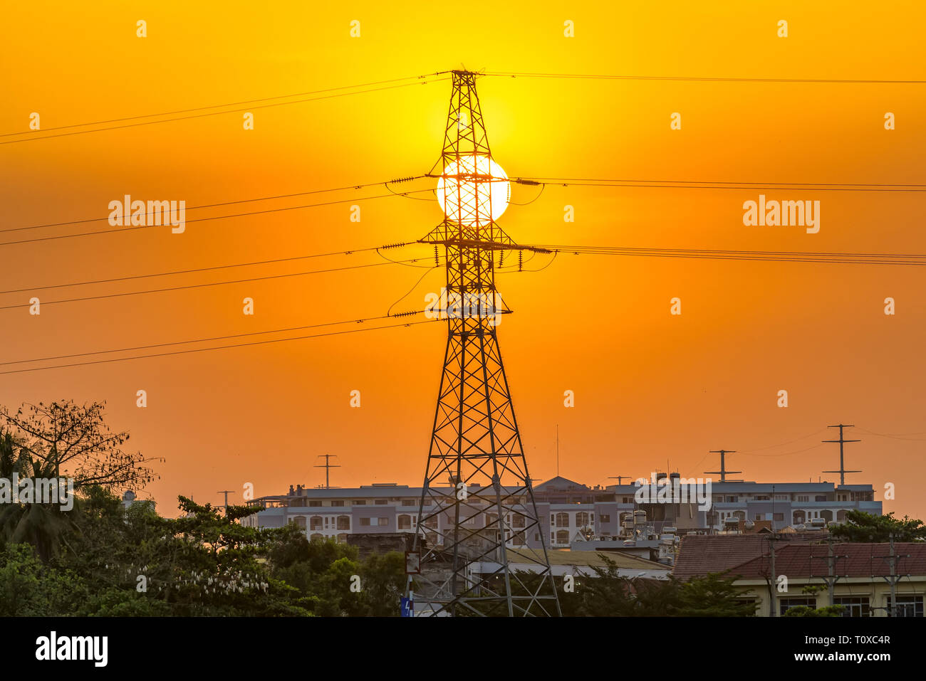 Electricity pole silhouett and the sun at sunset, they show the ...