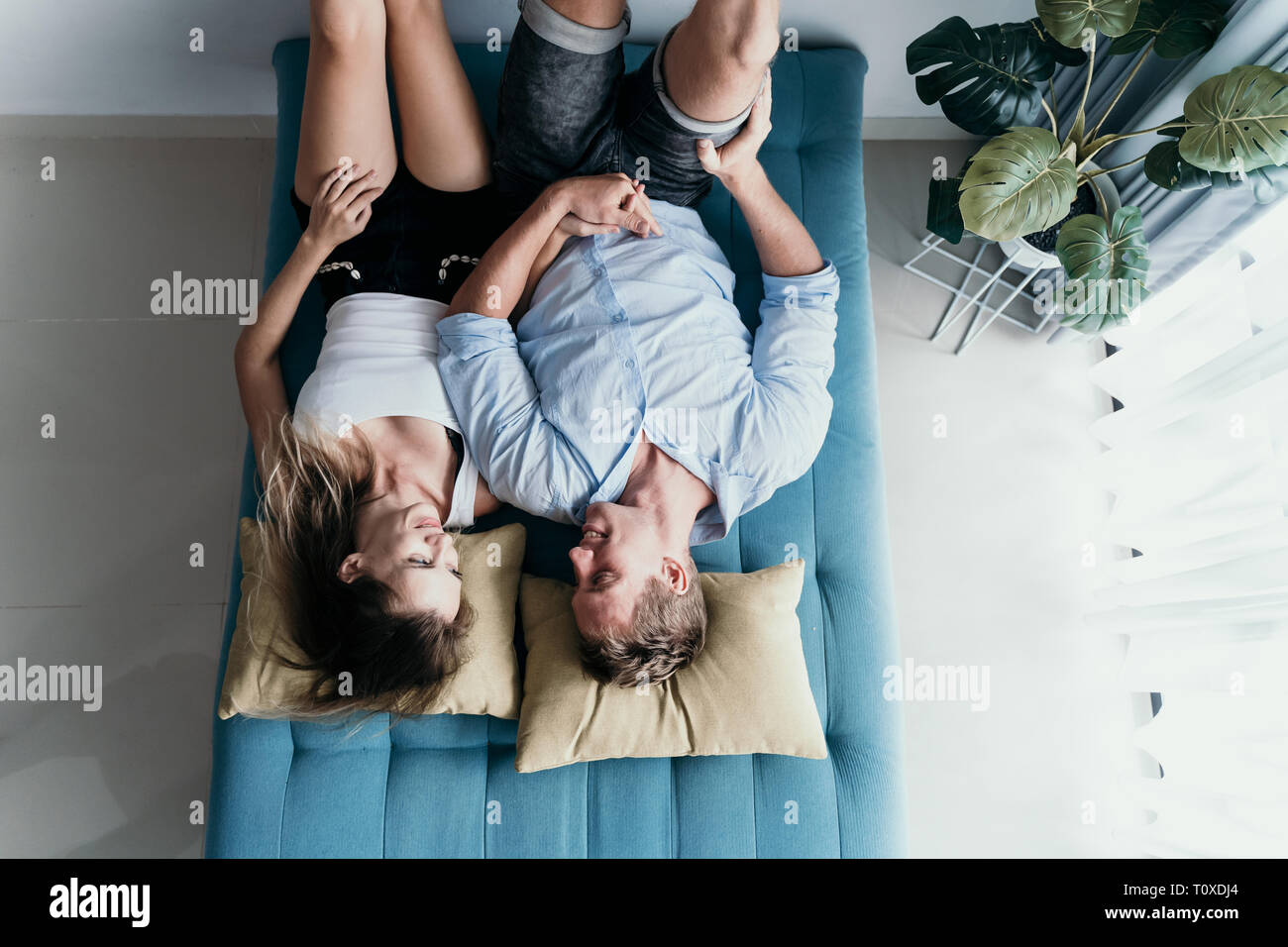Beautiful young romantic couple bonding Stock Photo - Alamy