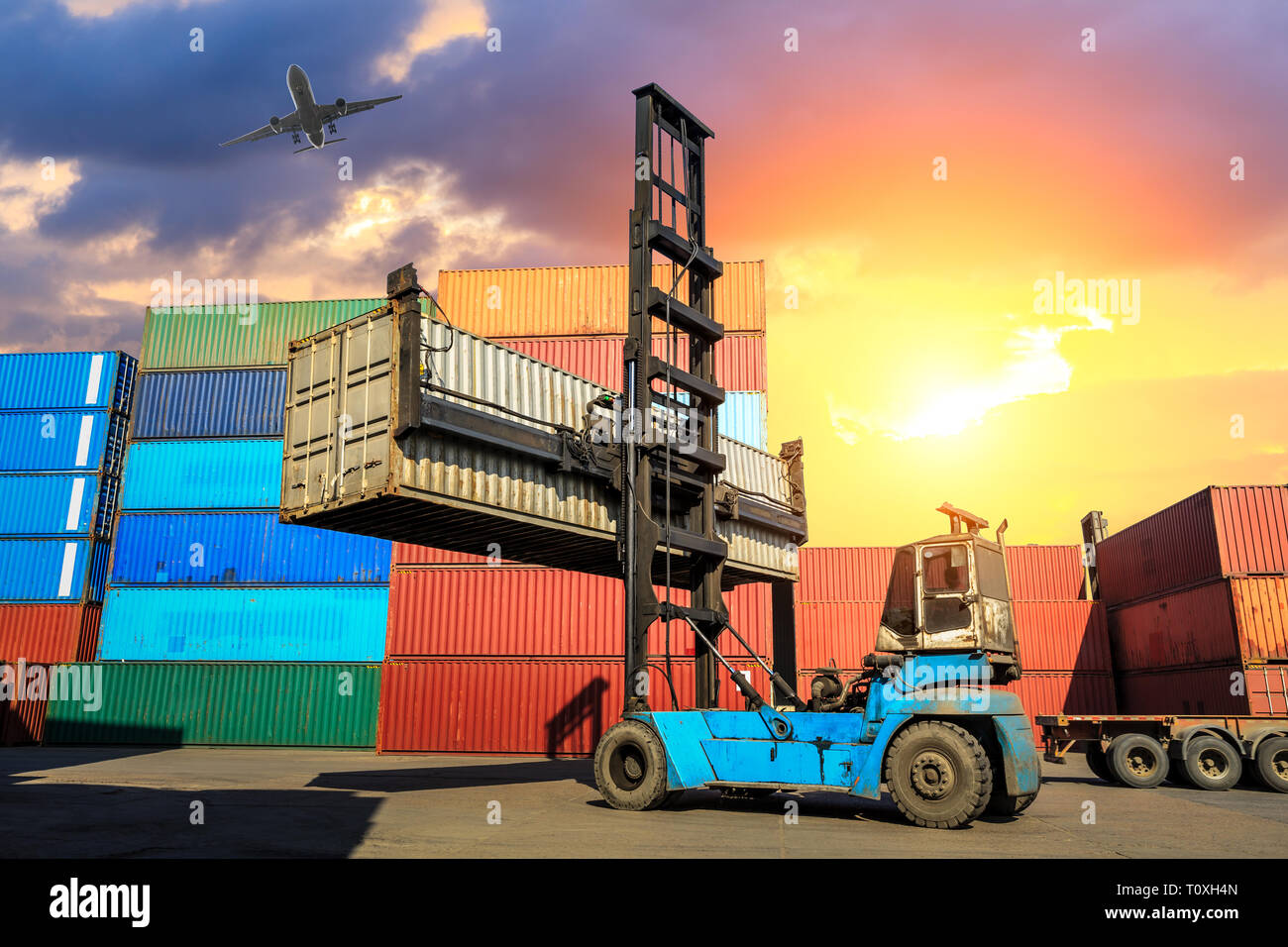 Forklift container loading and unloading cargo into the import-export ...