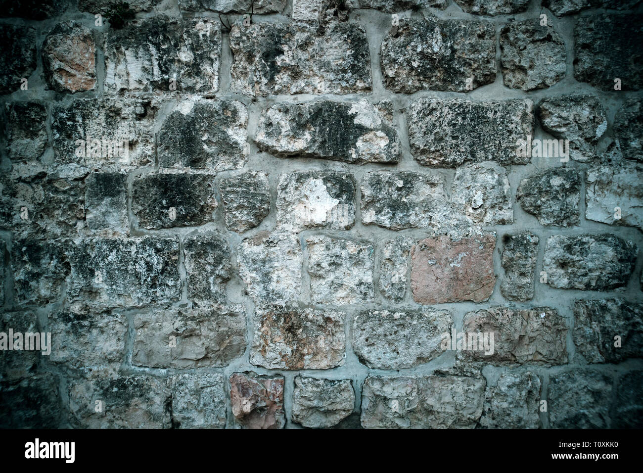 Urban background, grey ruined ancient brick wall. Antique brick ...