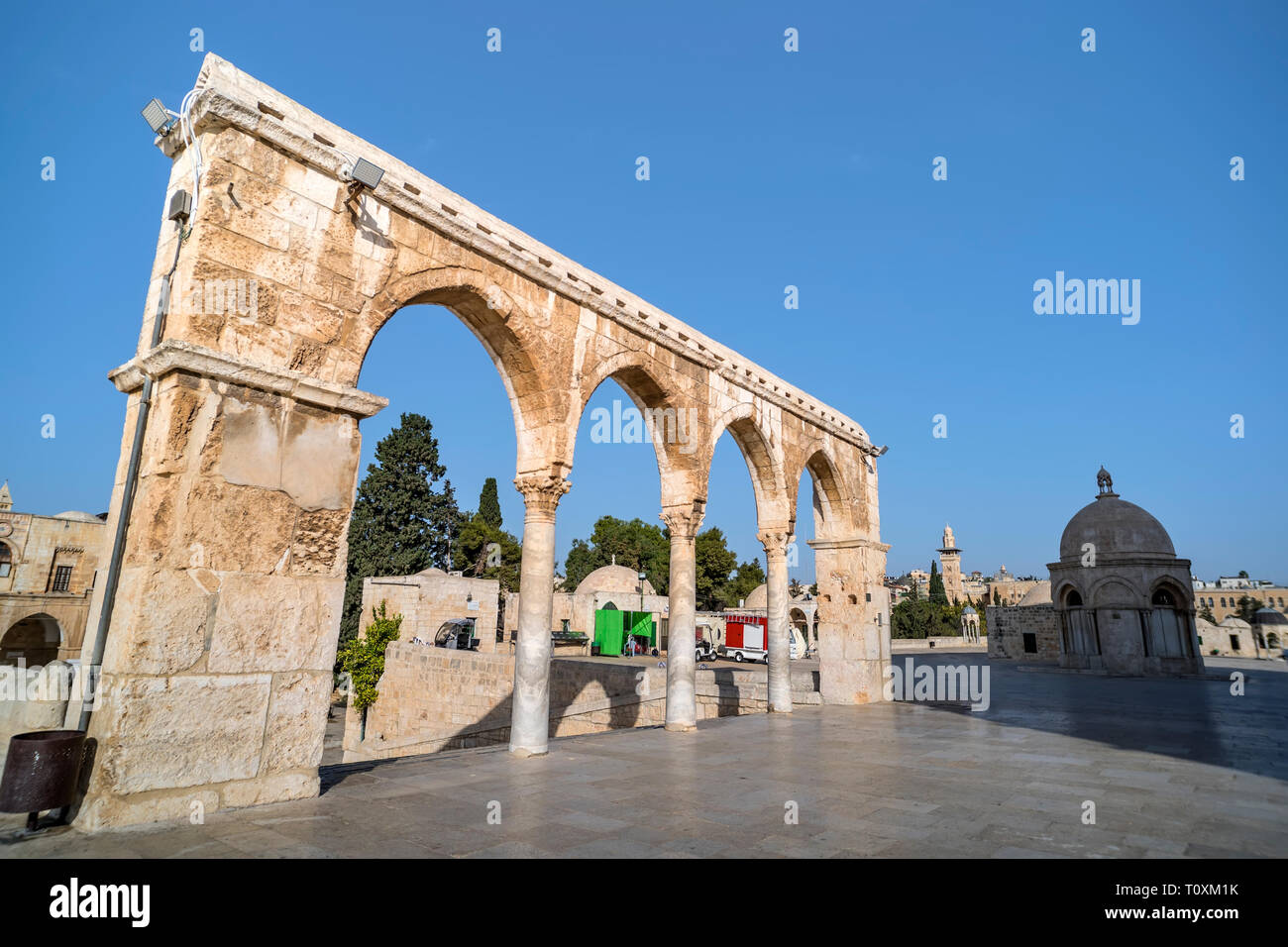 Scenery of old town of Jerusalem with arches and a mosque. main ...