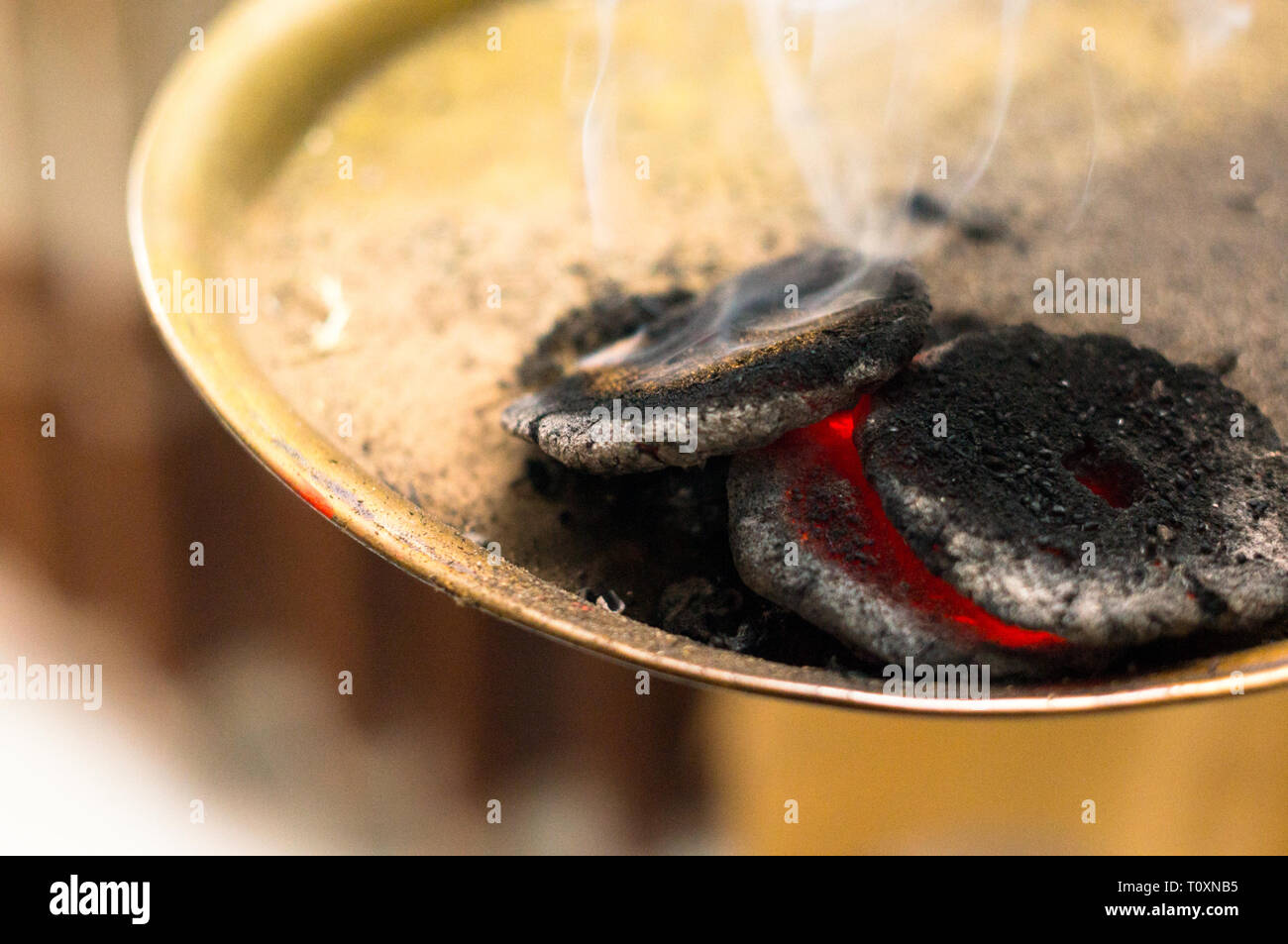 burning dung cake coal embers taken from the holika dahan fire hindu ...