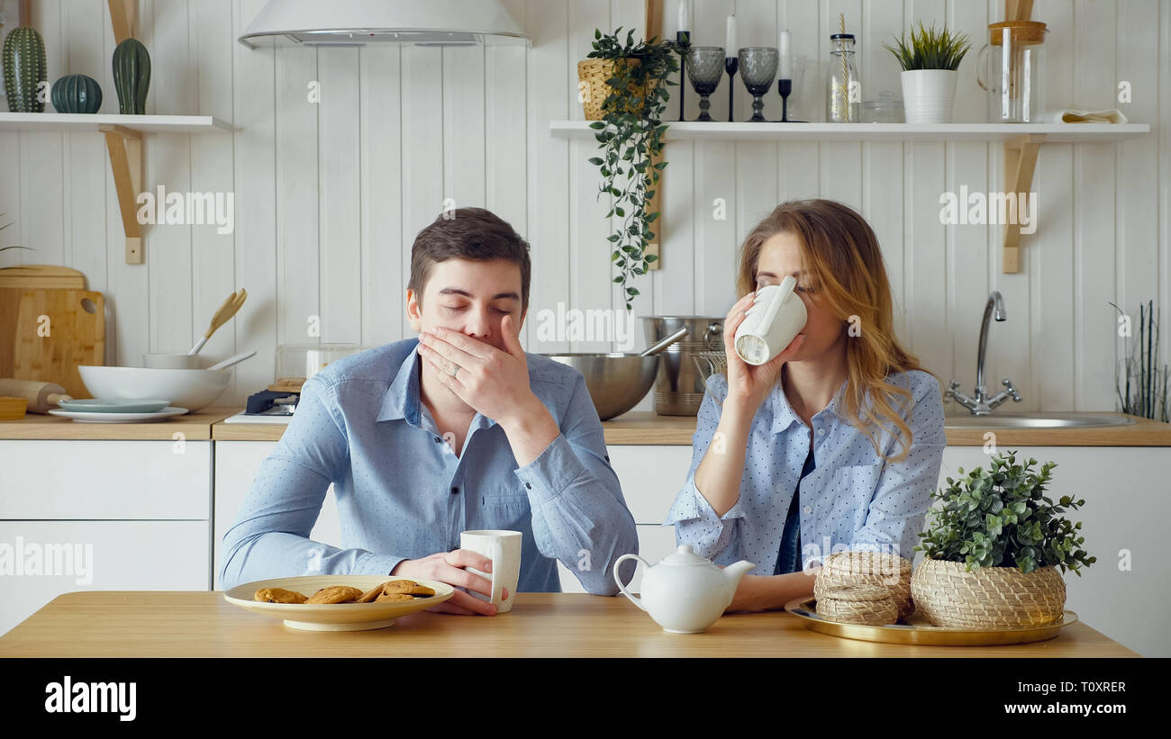 sad couple girl guy have breakfast drinking tea silently Stock Photo ...