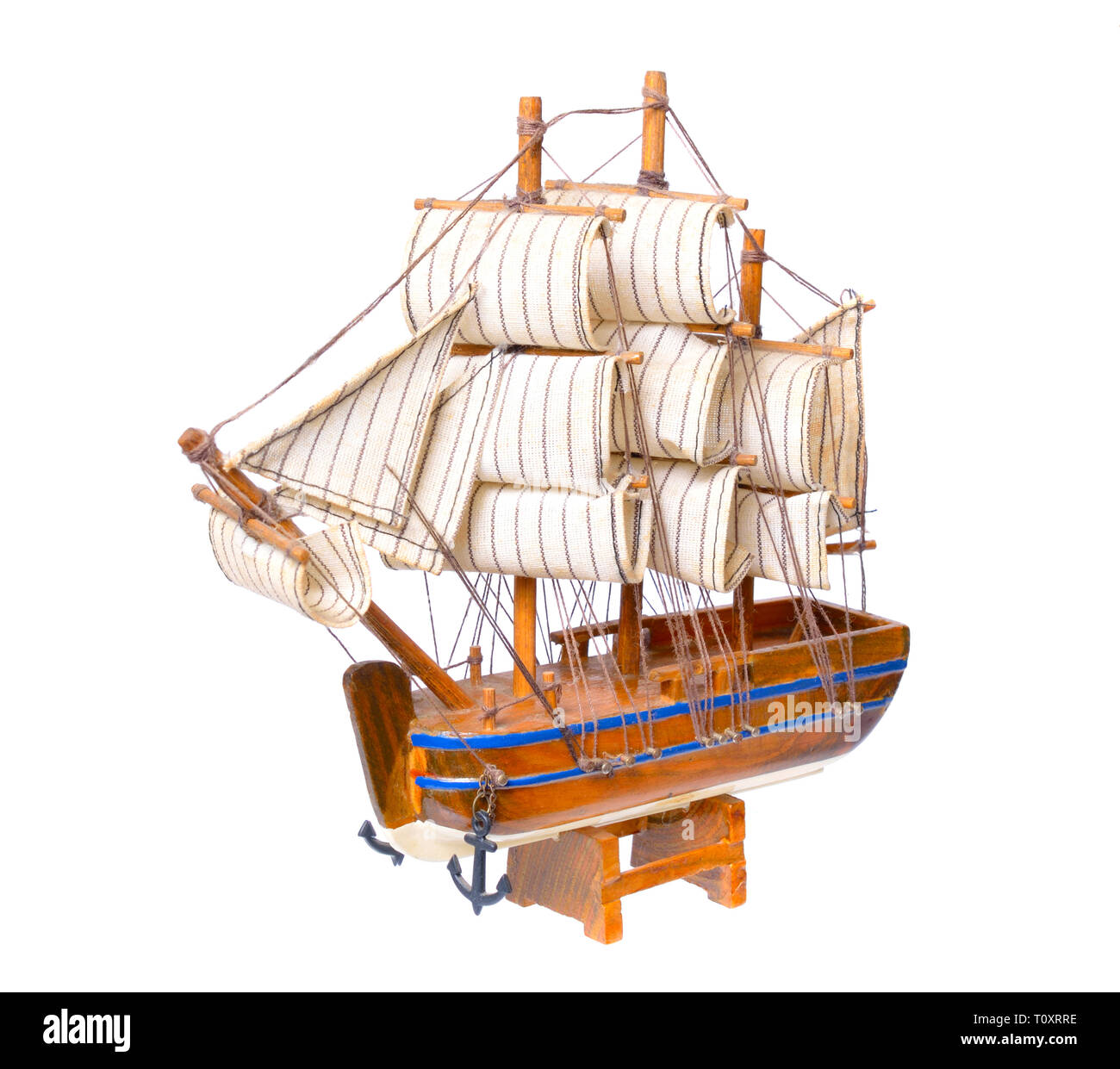 Small wooden souvenir boat isolated on white background Stock Photo - Alamy