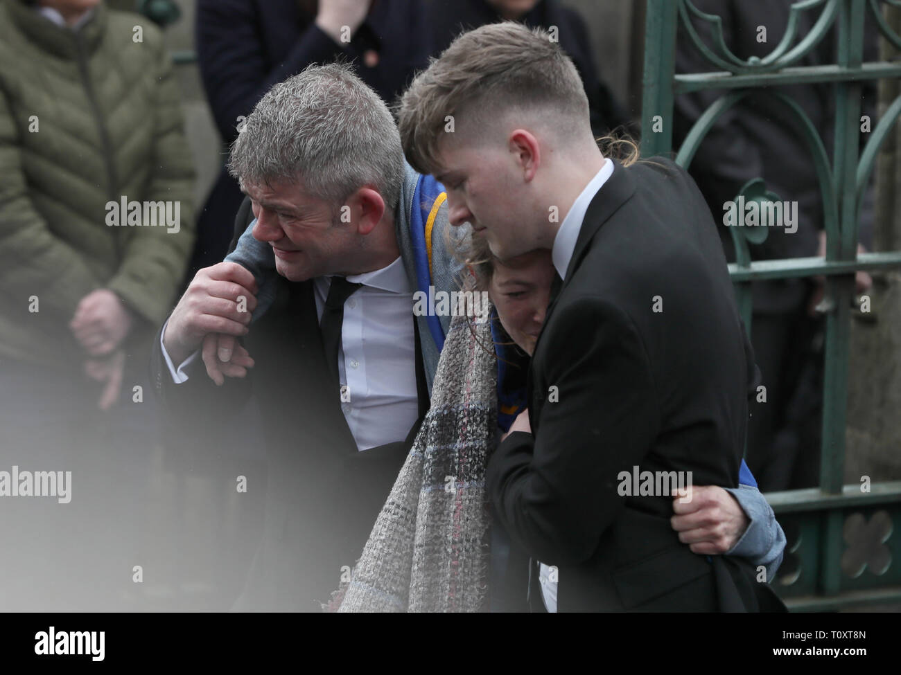 Mother Maria Barnard is held by her partner James Bradley as they ...