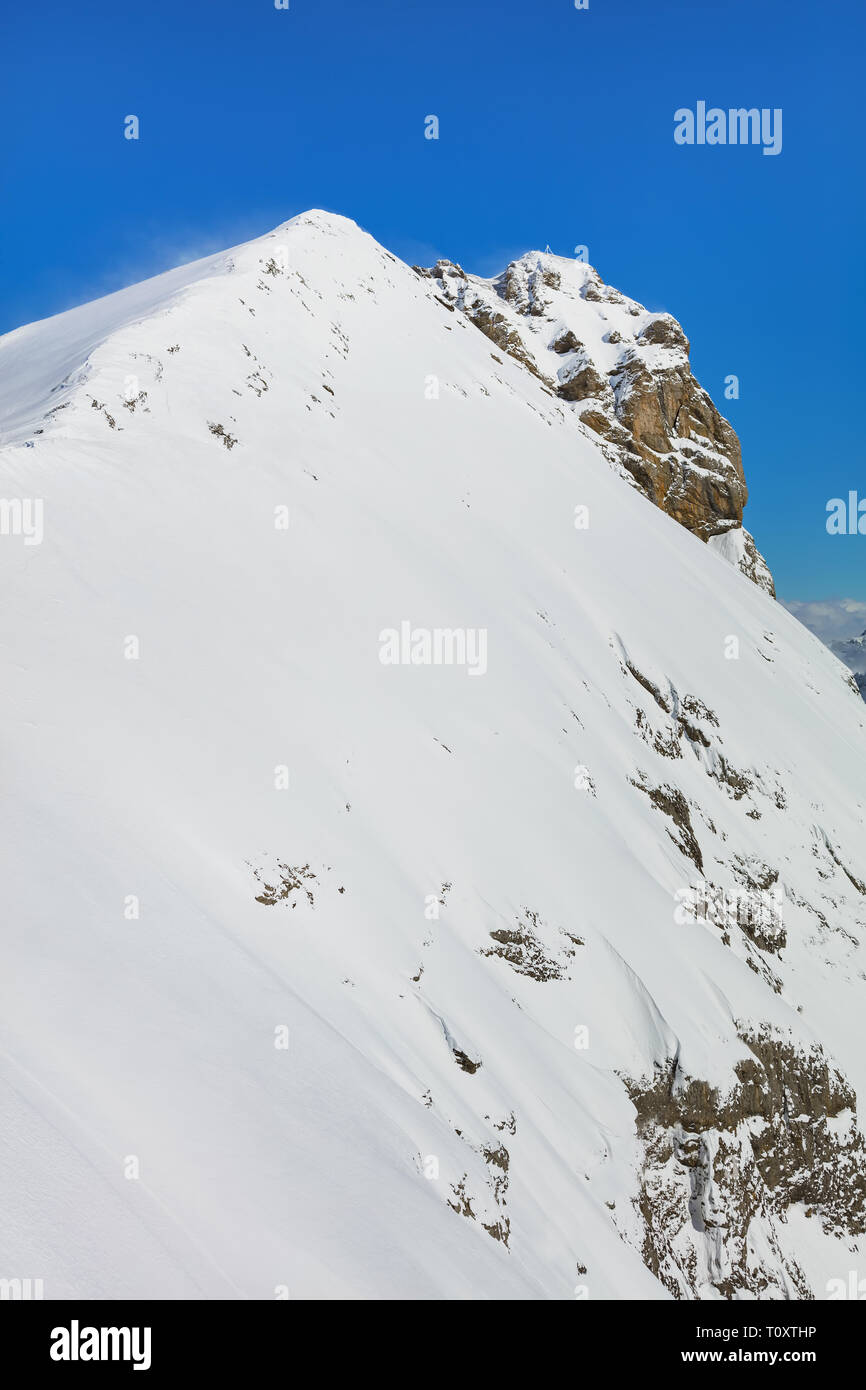 Summit of Mt. Titlis in Switzerland on a windy day in winter. The ...