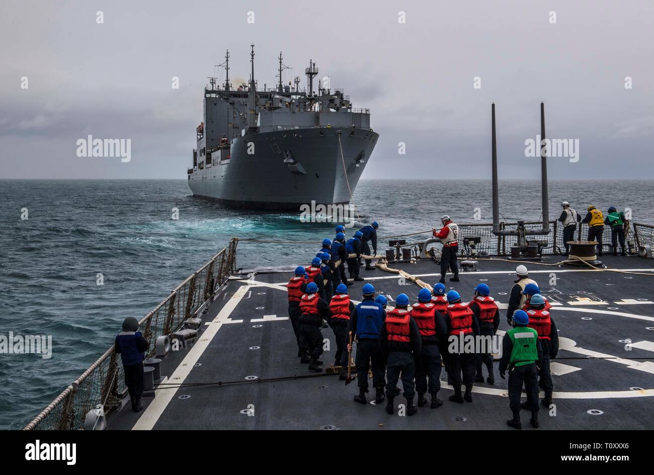 190318-N-KA046-0236 ATLANTIC OCEAN (March 18, 2019) Sailors handle line ...
